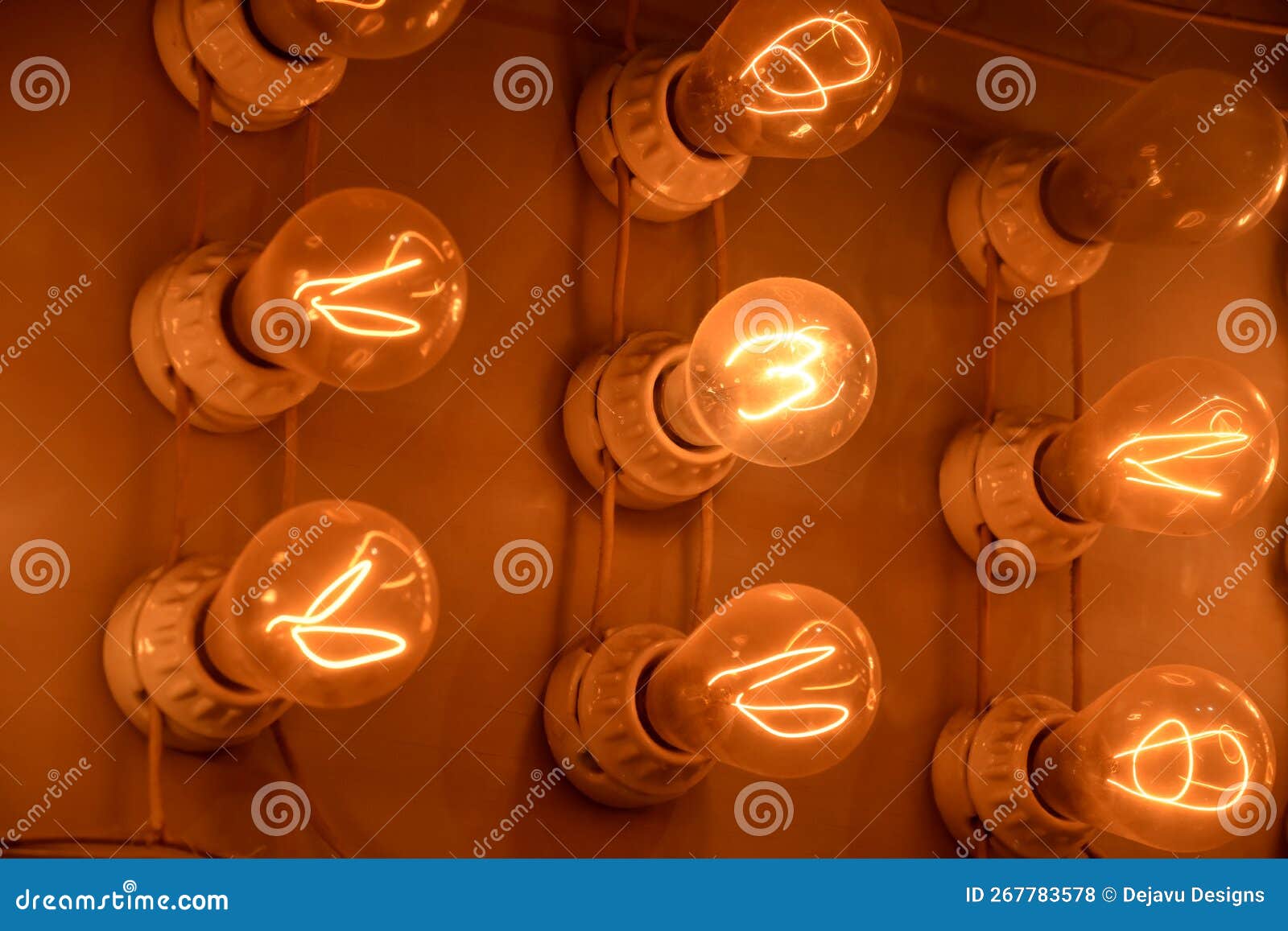 Bright Glowing Filaments in a Lit Lightbulb Stock Photo - Image of ...