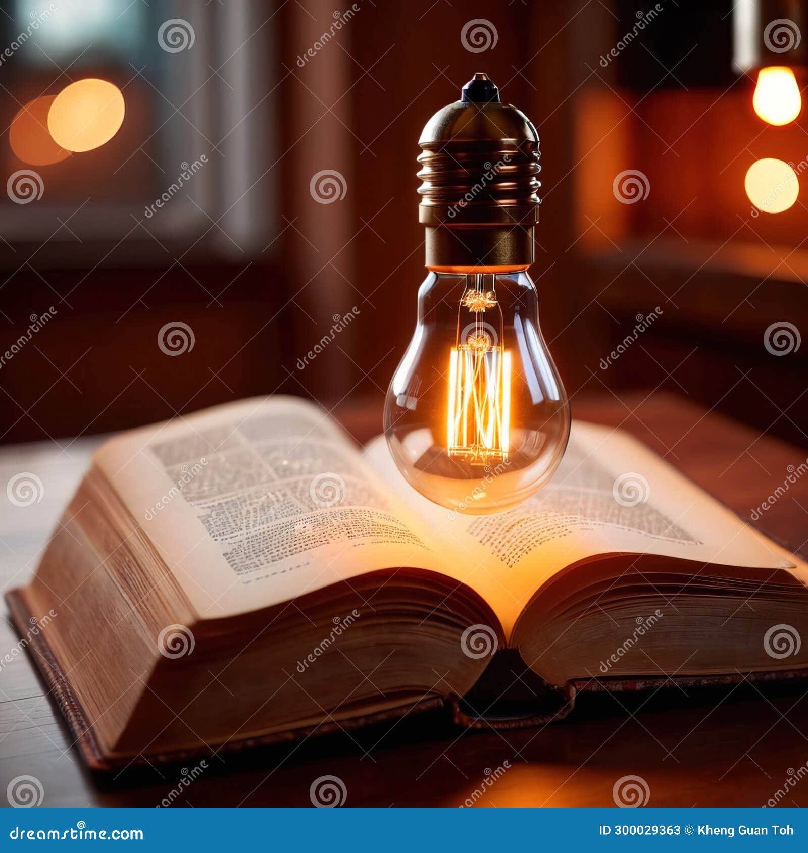 Bright Glowing Lightbulb on Open Book, Showing Enlightenment and ...