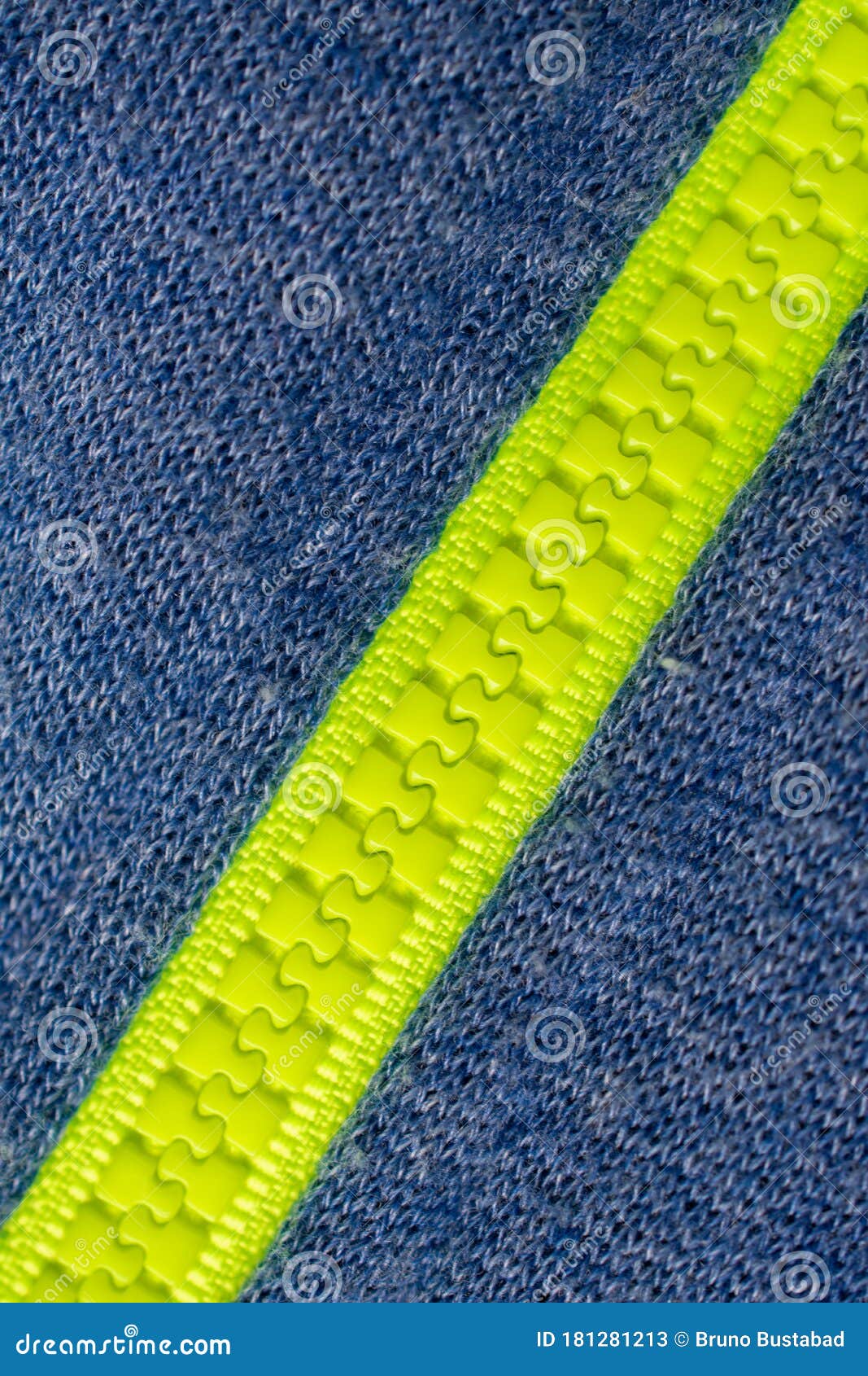 Bright Green Plastic Zipper on a Blue Fabric Texture, Going from Bottom ...