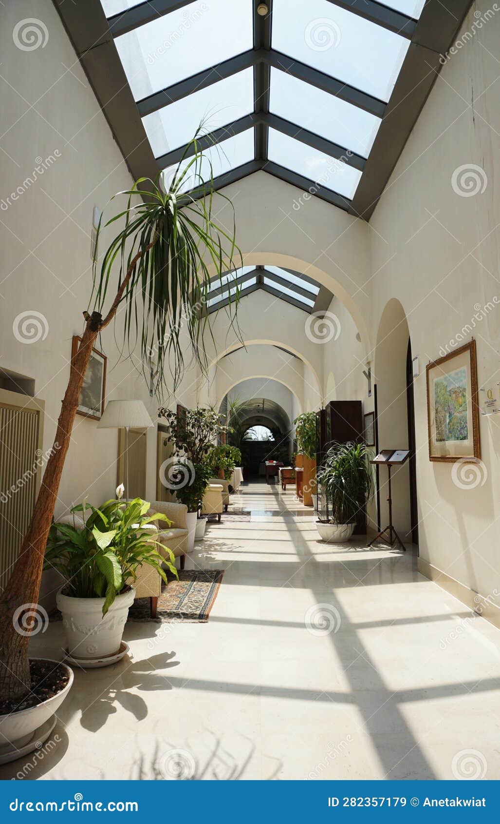 Bright Hotel Hall with Glass Ceiling and Sun Light Stock Image - Image ...