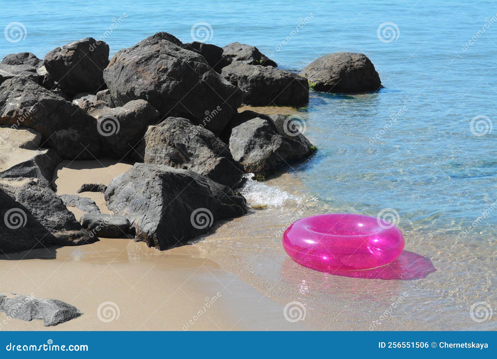 Bright Inflatable Ring on Sandy Beach Near Sea Stock Photo - Image of ...