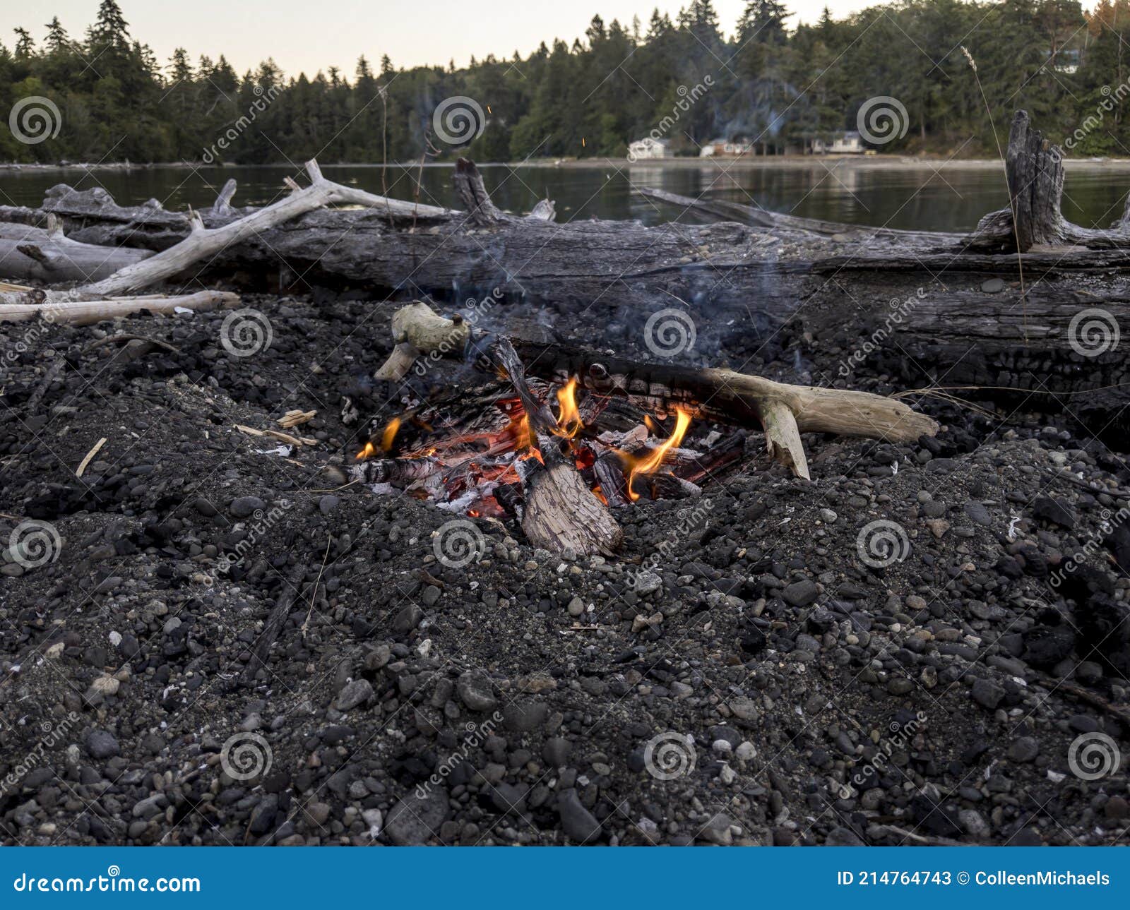 A Bright, Lakeside Campfire at Dusk, Perfect for Roasting Smores Stock ...