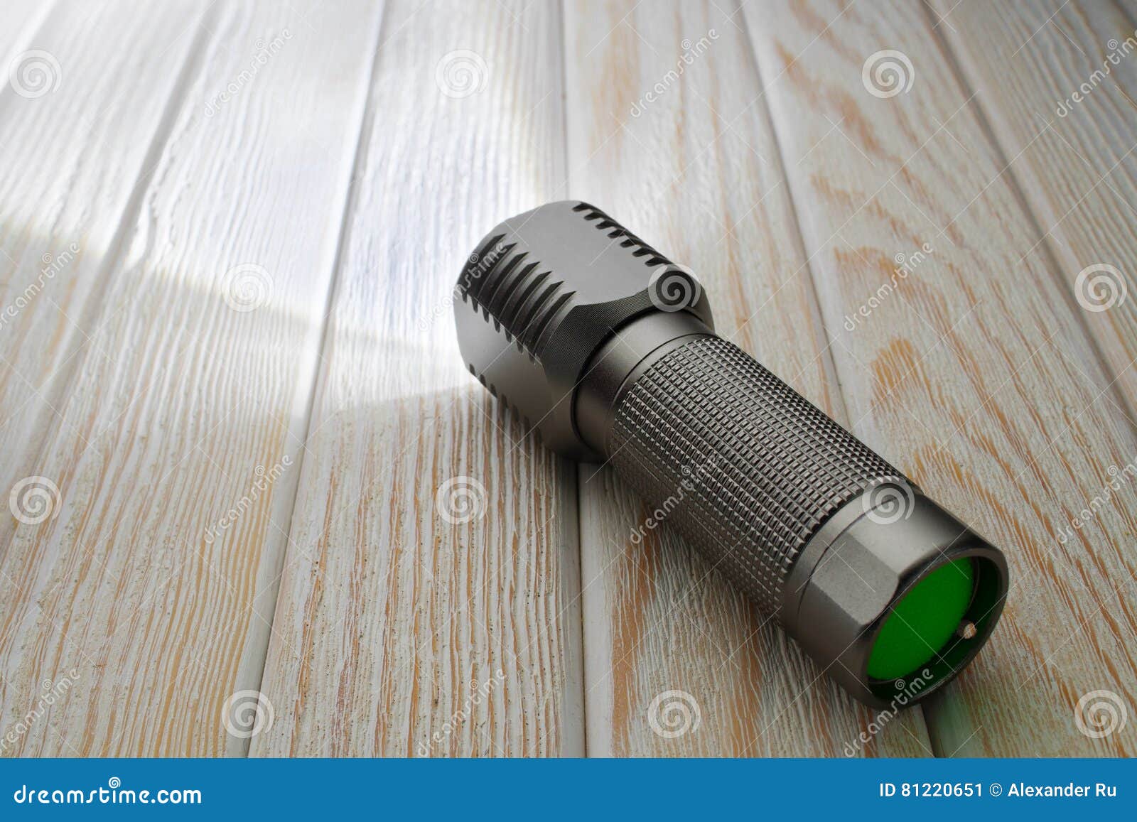 Bright LED Flashlight Shines on the Wooden Surface. Stock Image - Image ...