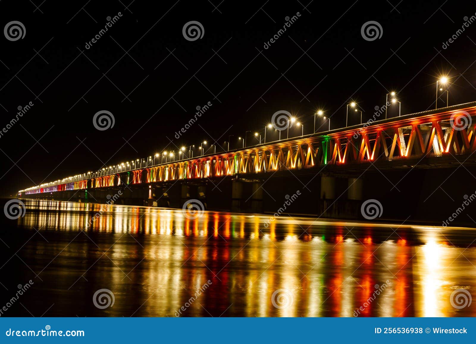 Bright Light on the Bridge with Its Reflection on the Lake Stock Photo ...