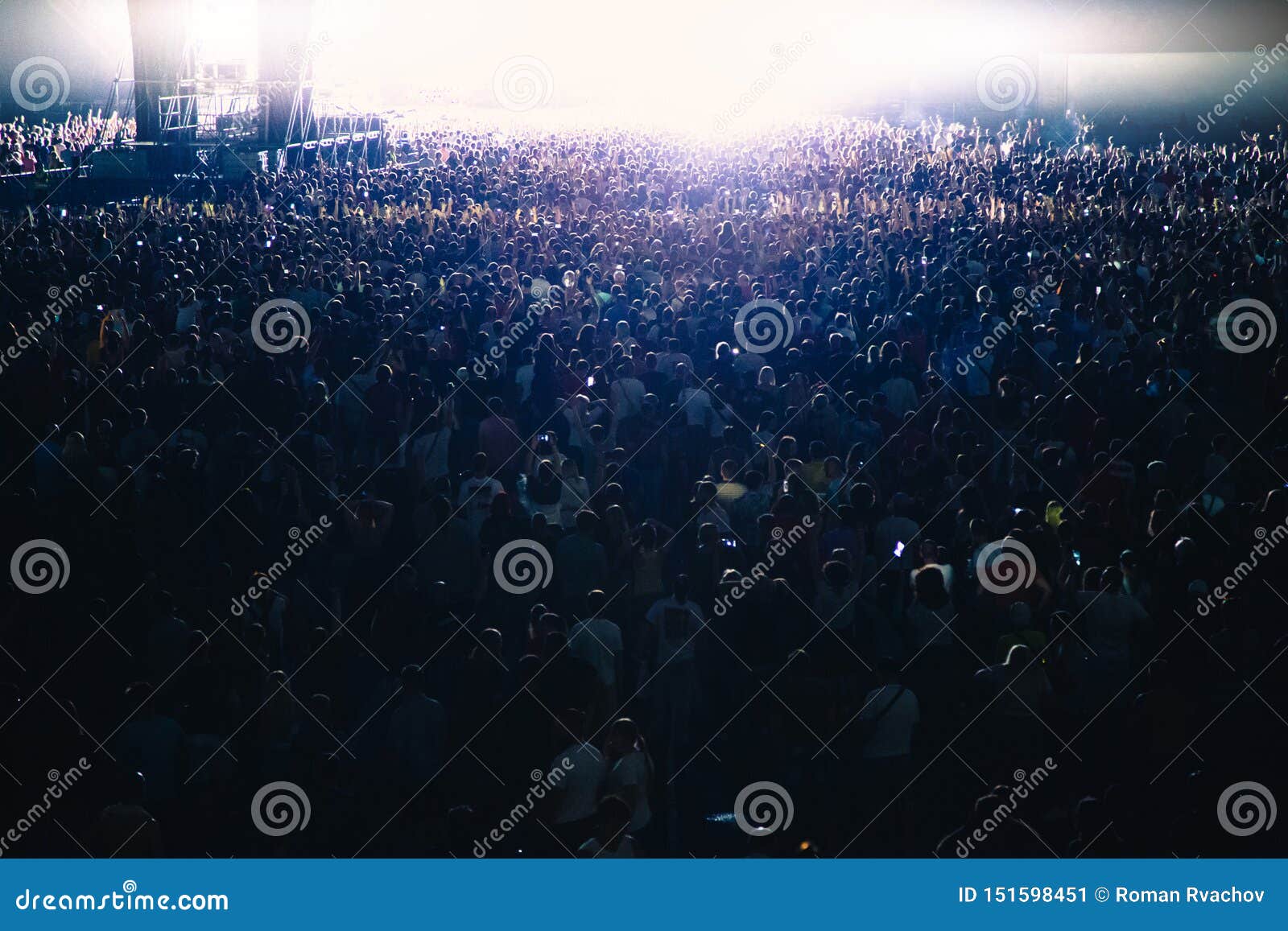 The Bright Light of the Stage Illuminates a Huge Concert Crowd. Stock ...