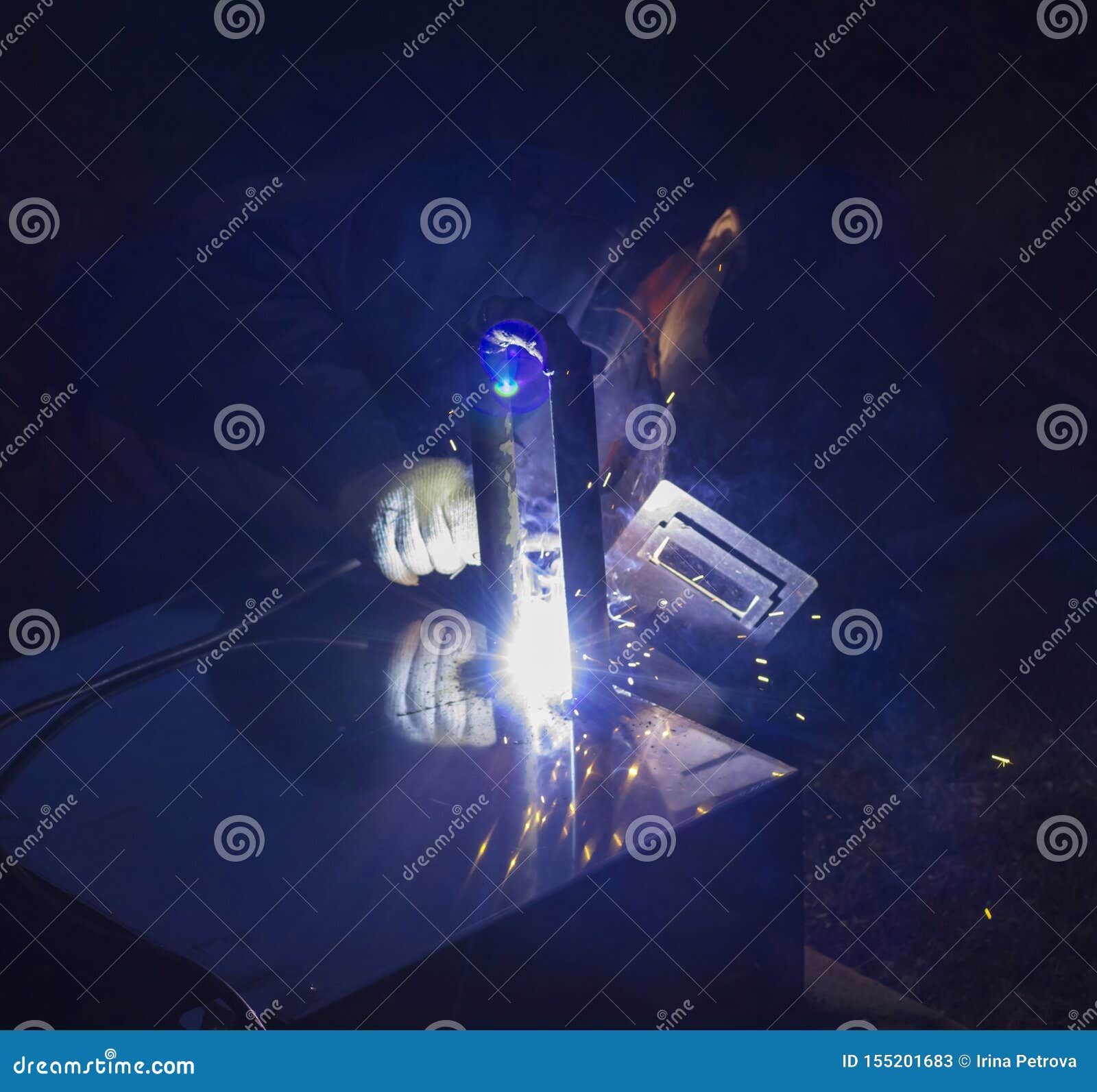 The Bright Light from Welding, a Professional Welder Stock Image ...
