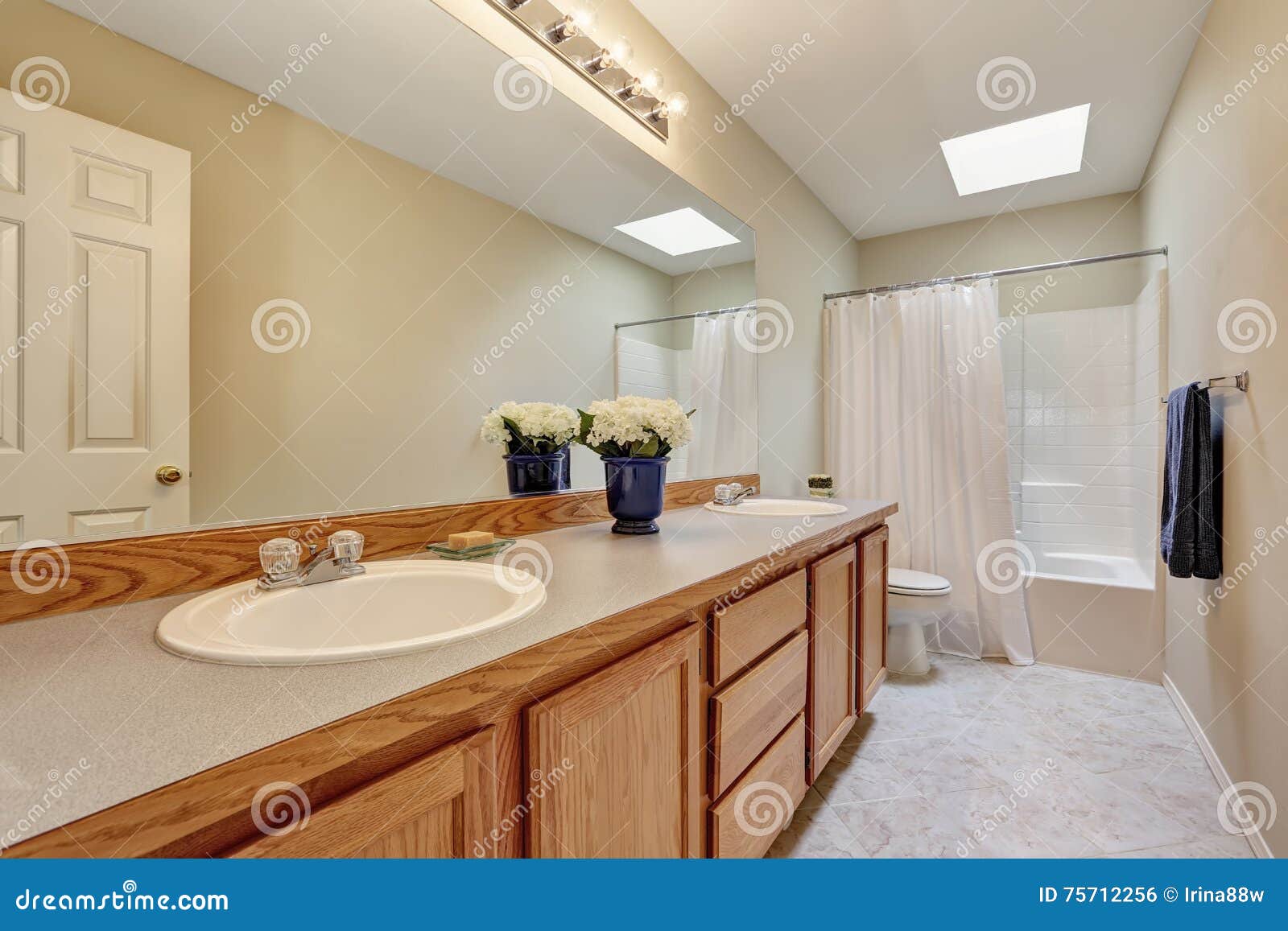 Bright Long Bathroom Interior with Large Double Vanity Unit. Stock ...