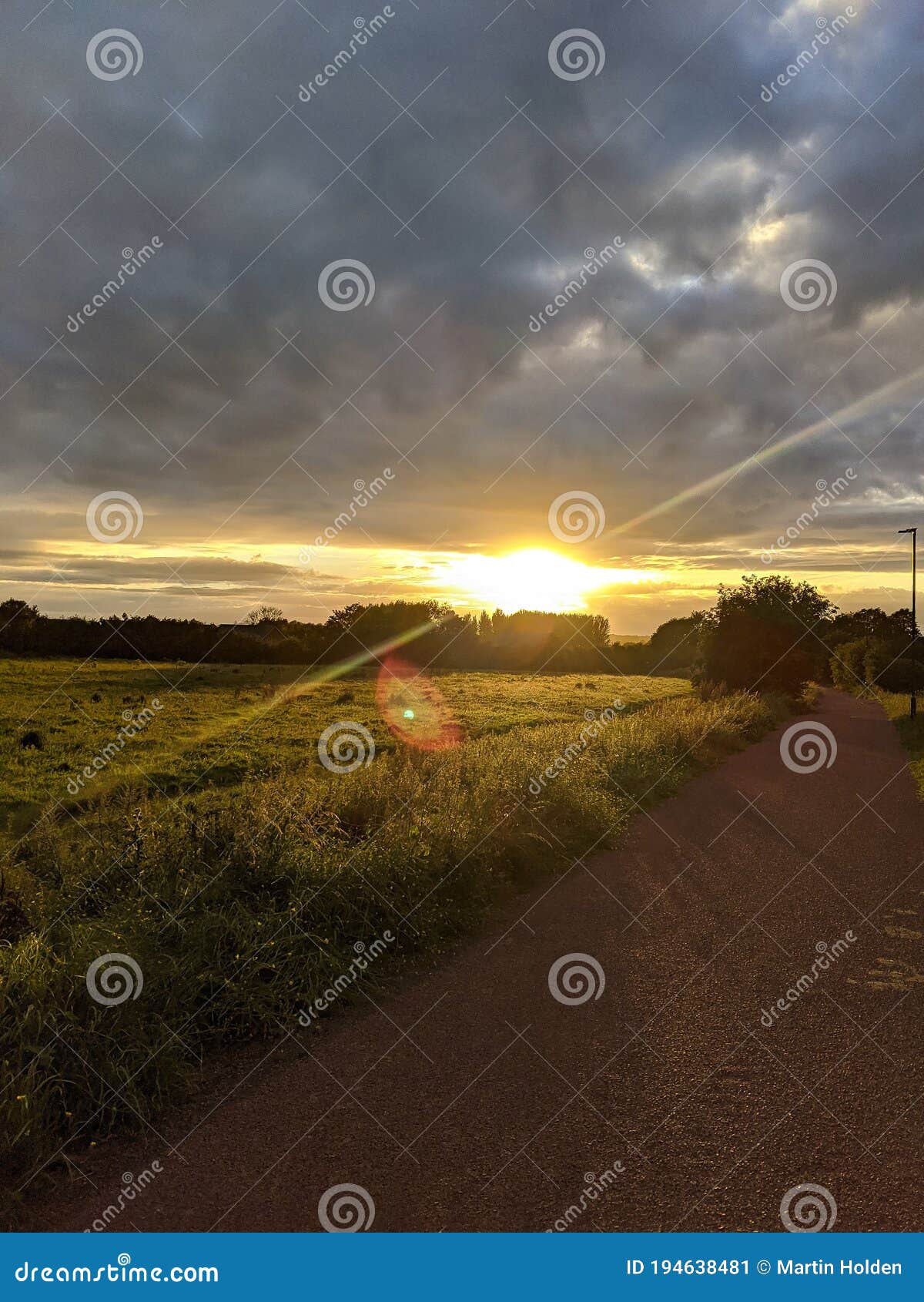 Bright low sunset stock image. Image of sunny, dusk - 194638481