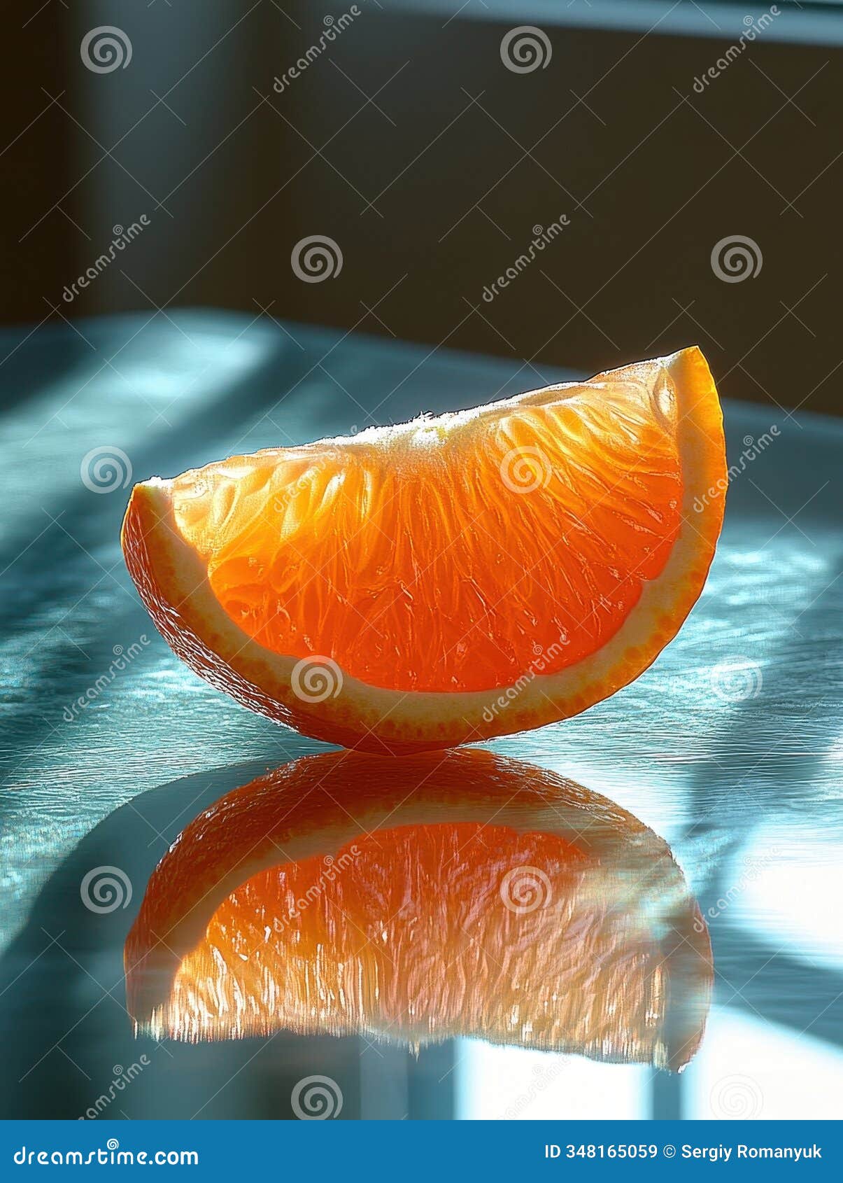 Bright Mandarin Segment Resting on a Glass Surface Reflecting Light and ...