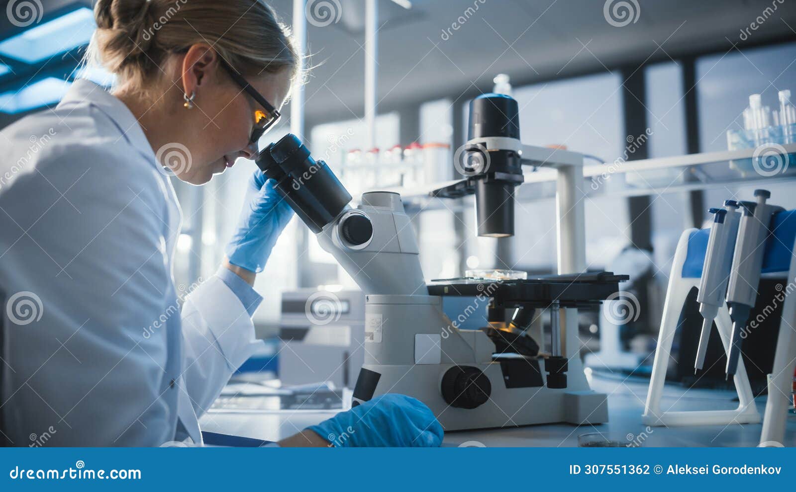 In Bright Medical Science Laboratory: Beautiful Microbiologist Looks ...