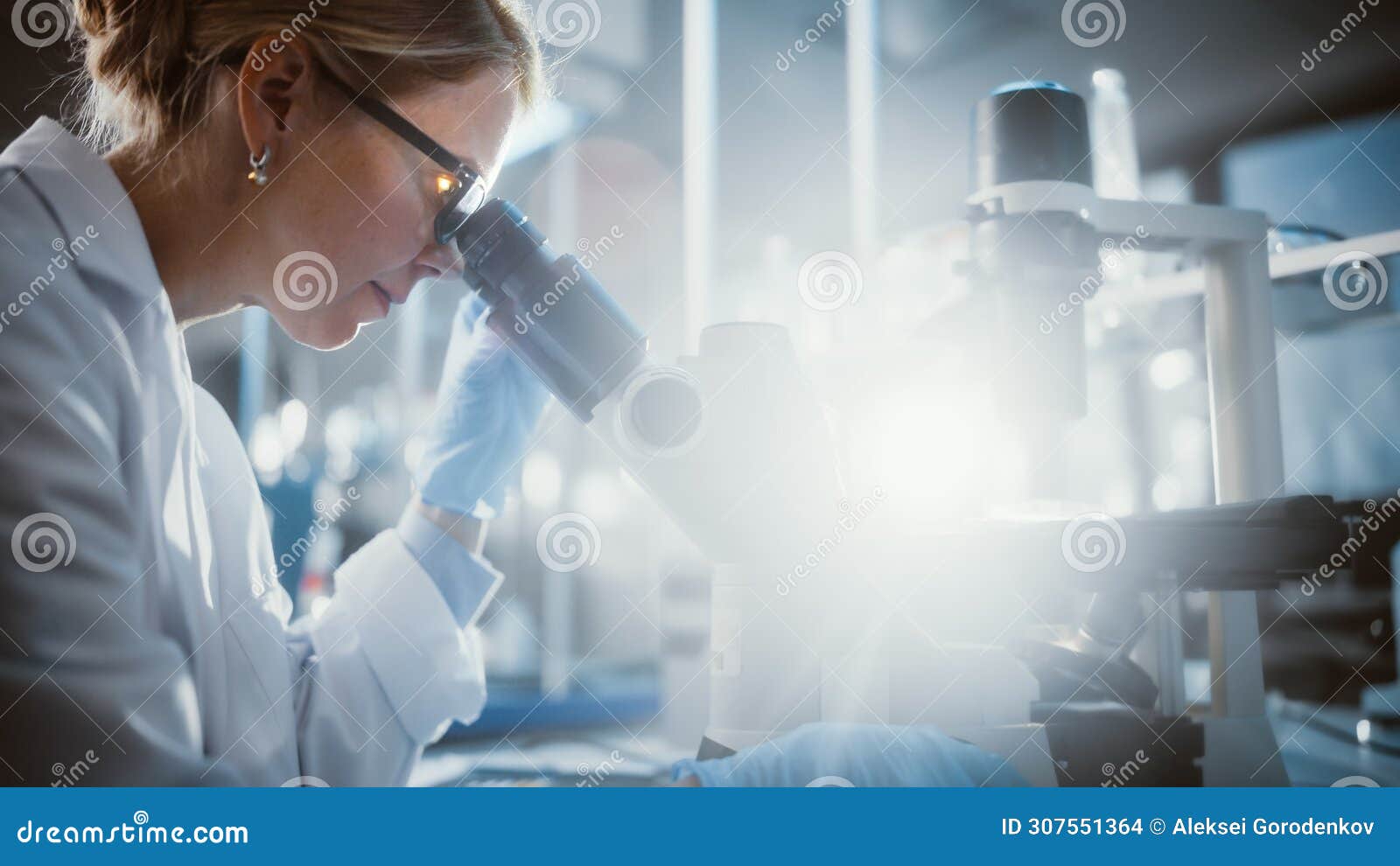Bright Medical Science Laboratory: Beautiful Microbiologist Looks Under ...