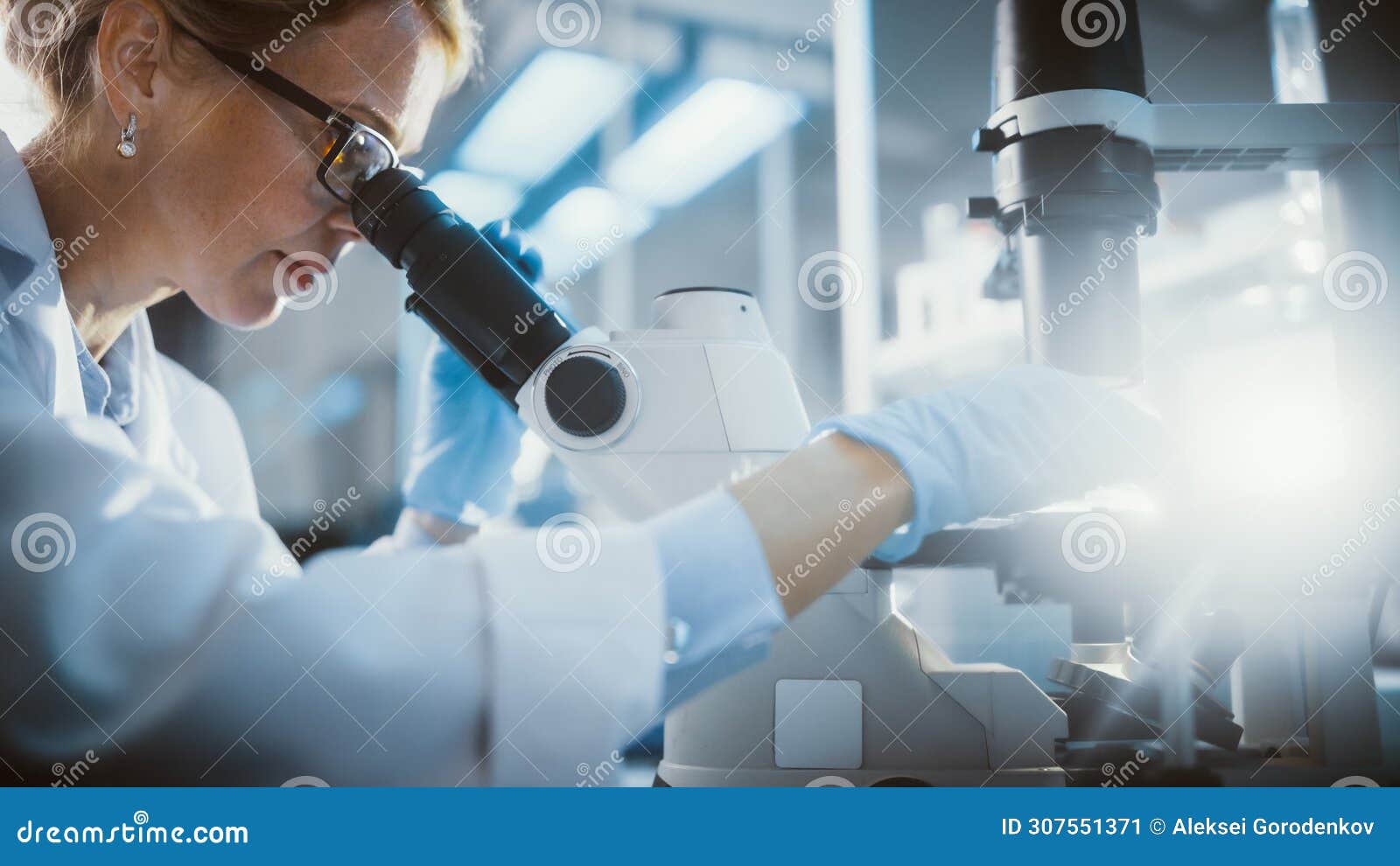 Bright Medical Science Laboratory: Beautiful Microbiologist Looks Under ...