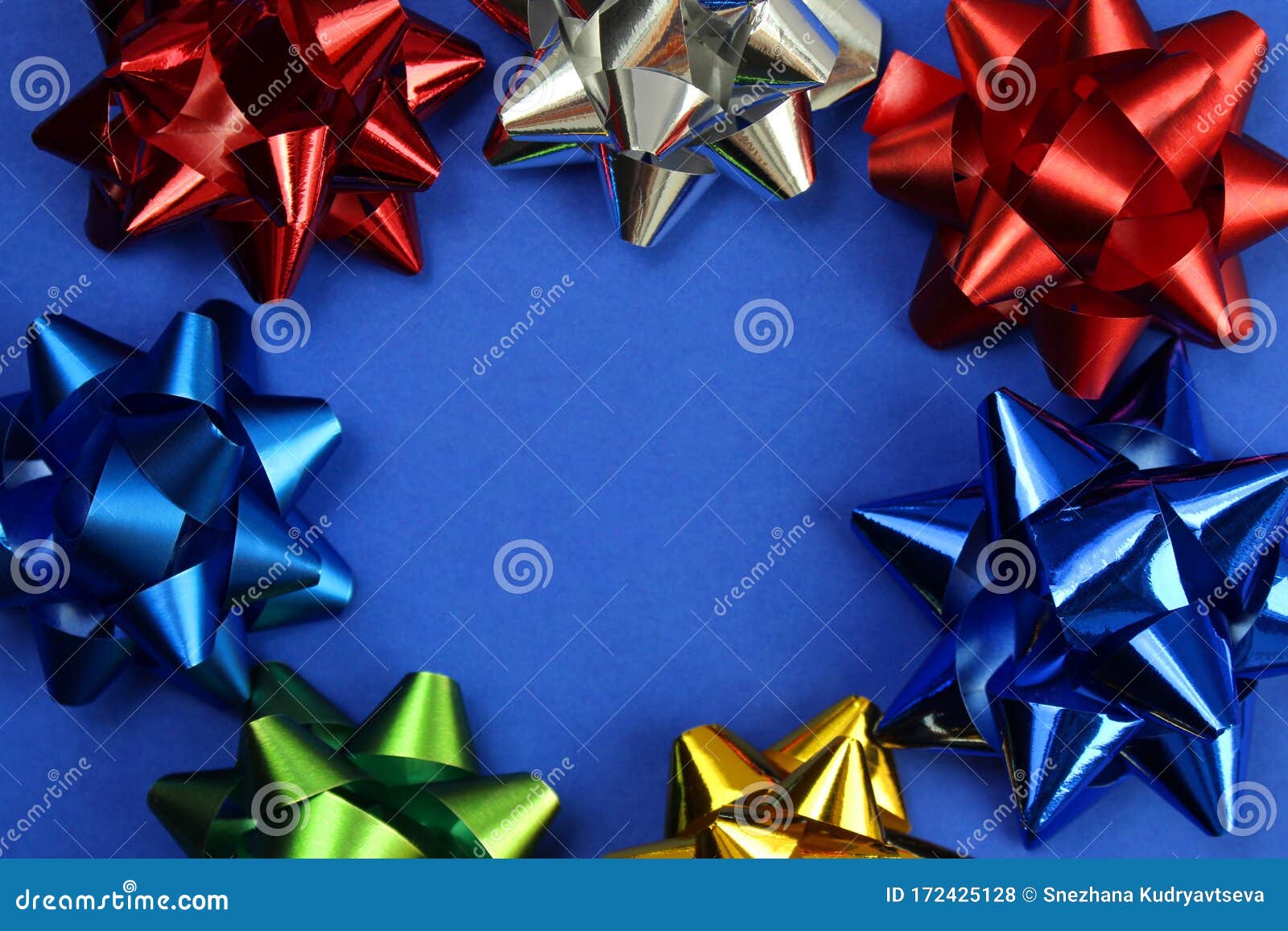 Bright Multi-colored Bows in the Form of Stars on a Blue Background ...
