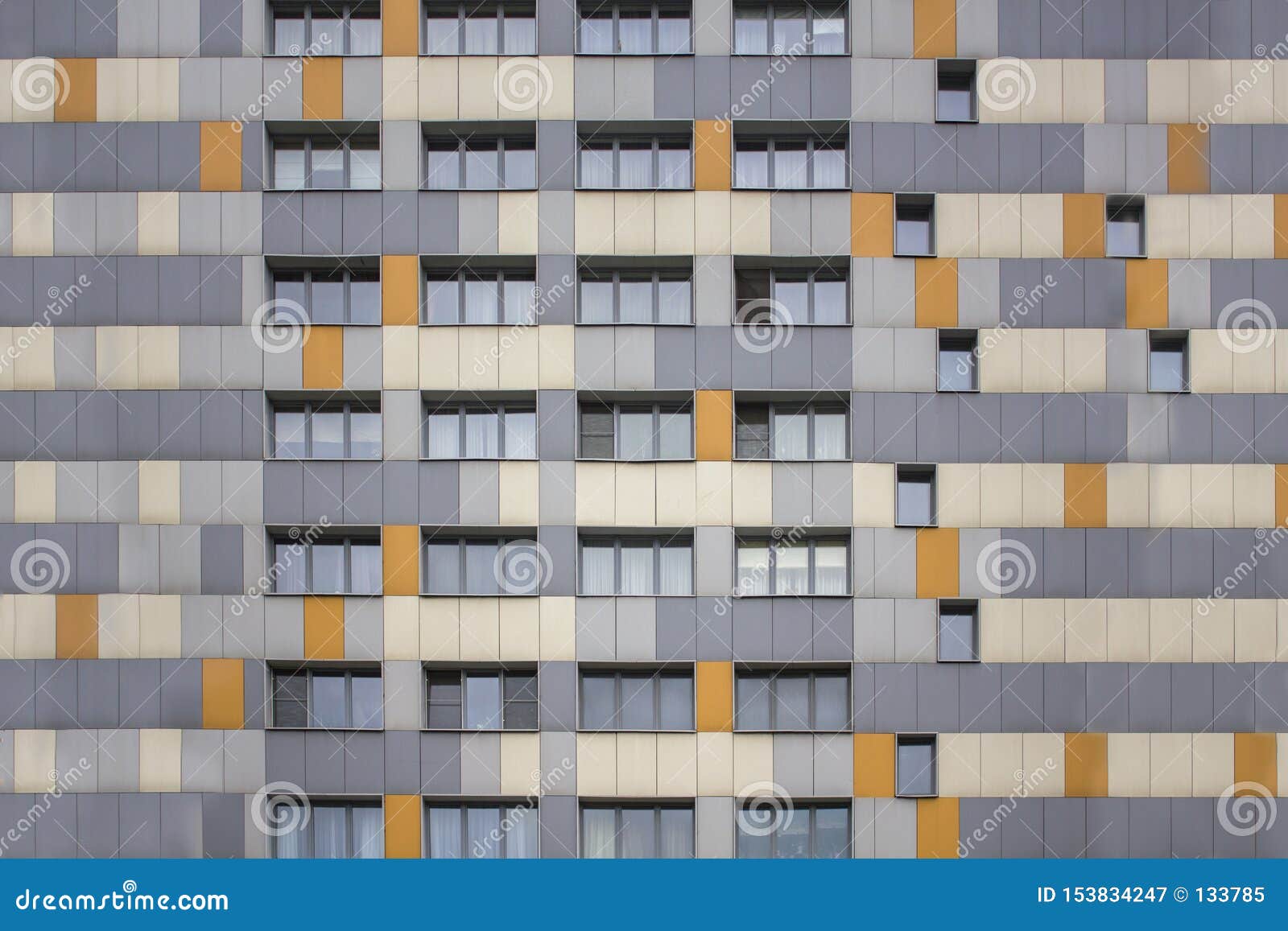 Bright Multi-colored Facade of a High-rise Modern Building with Windows ...