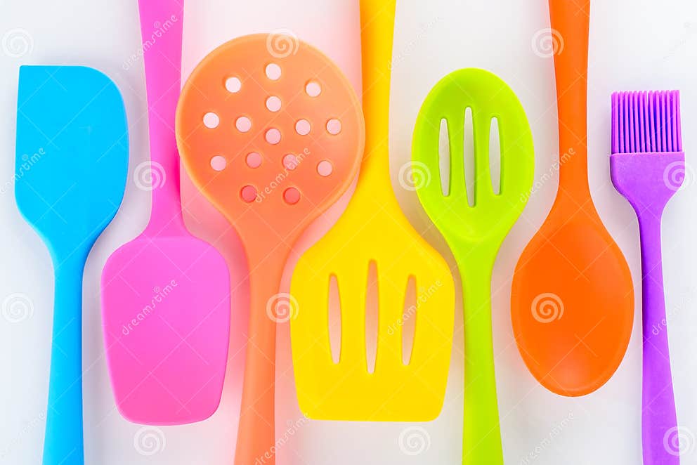 Bright Multi Colored Kitchen Utensils on White Background Stock Photo ...