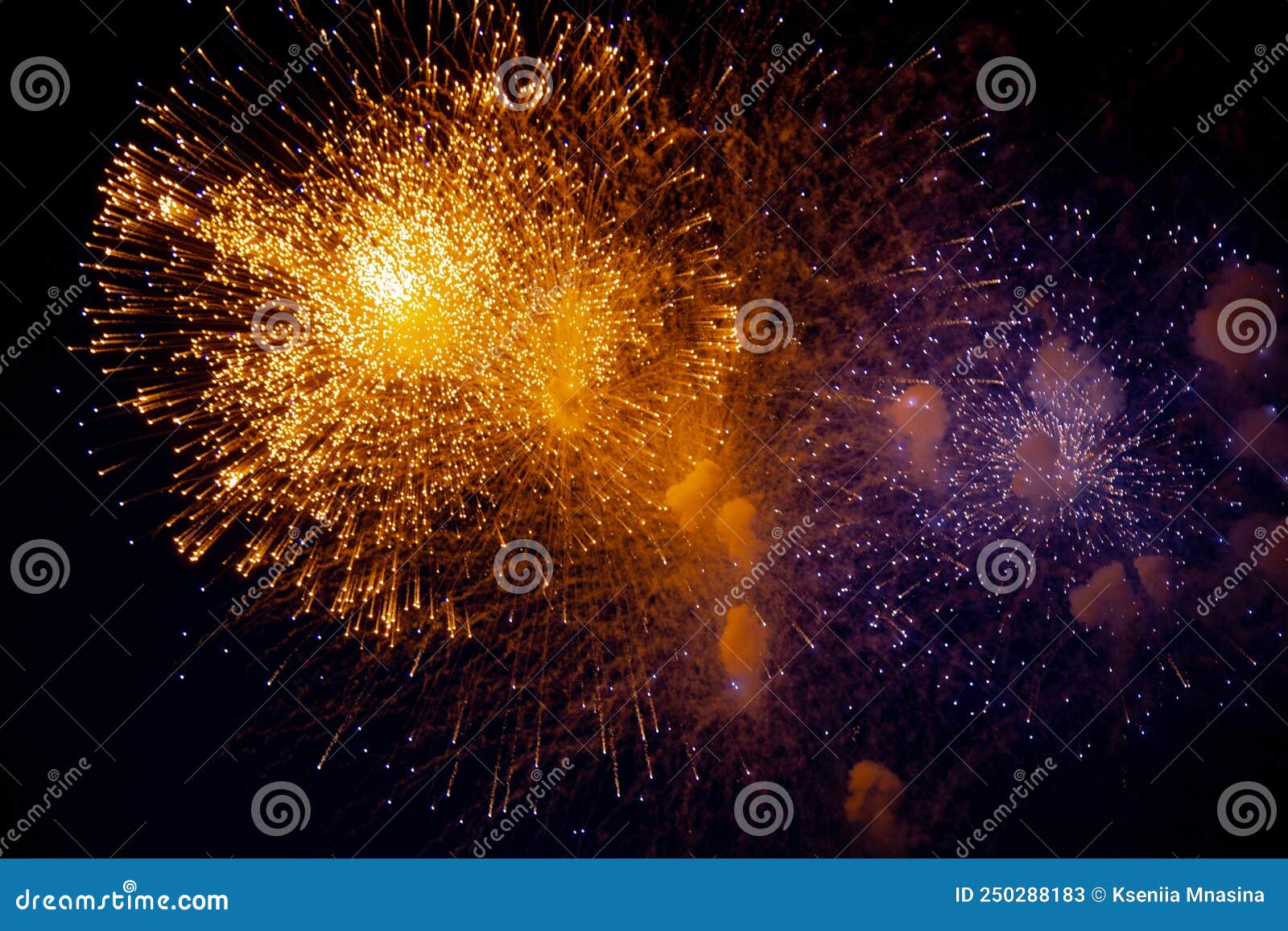 A Bright Orange Firework and Next To it a Blue Firework with Sparks on ...
