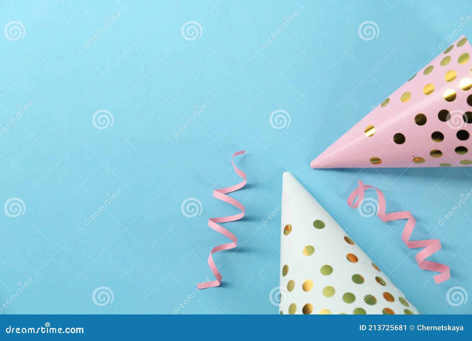 Bright Party Hats and Serpentine Streamers on Light Blue Background ...