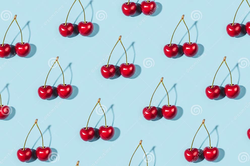Bright Pattern of Ripe Cherries on a Blue Background. Stock ...