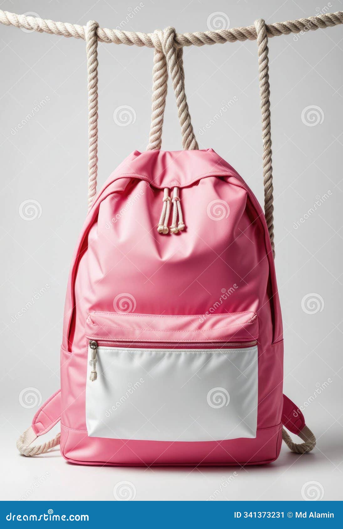 Pink Backpack with White Pocket Hanging on Rope for School Travel or ...