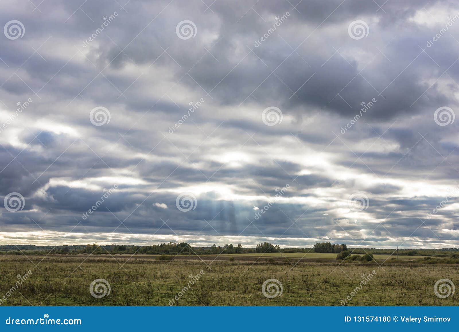 The Bright Rays of the Sun Pierce through the Overcast Clouds in the ...