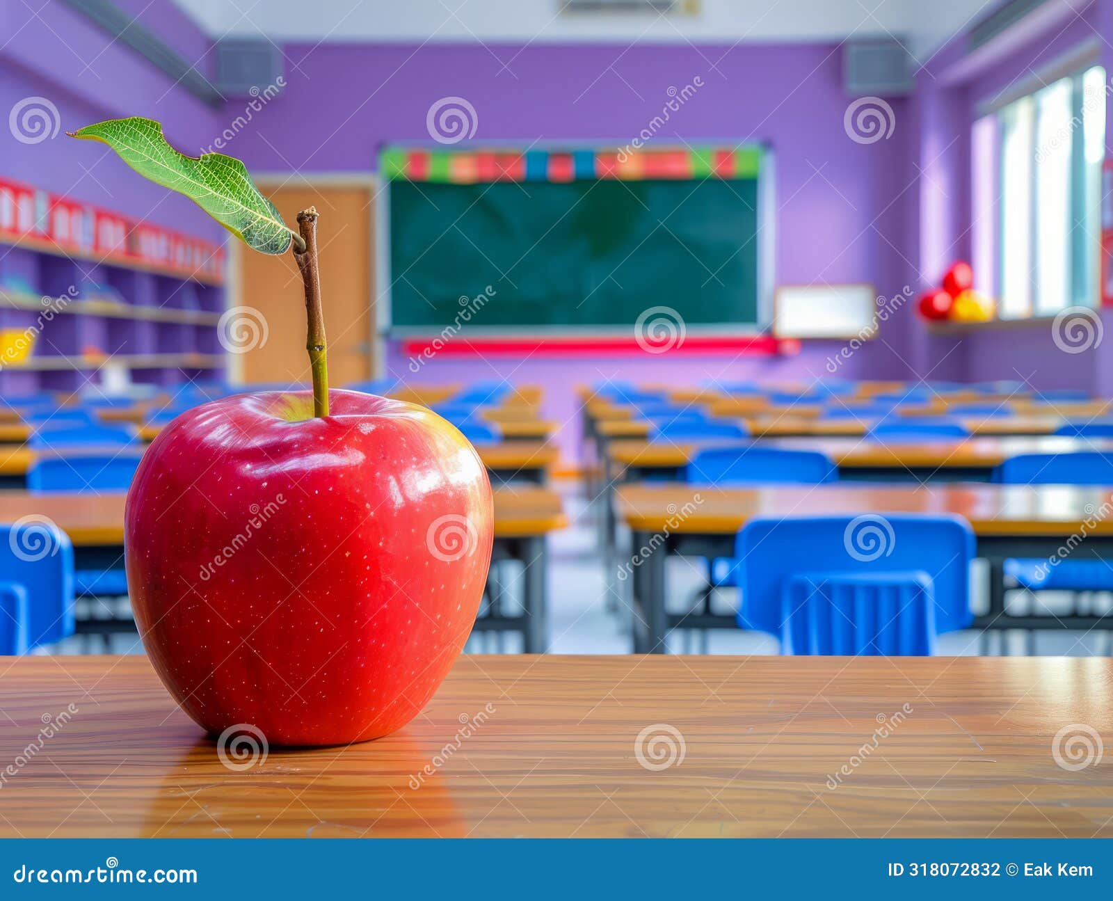 Bright Red Apple on Desk in Empty Classroom with Desks and Blackboard ...
