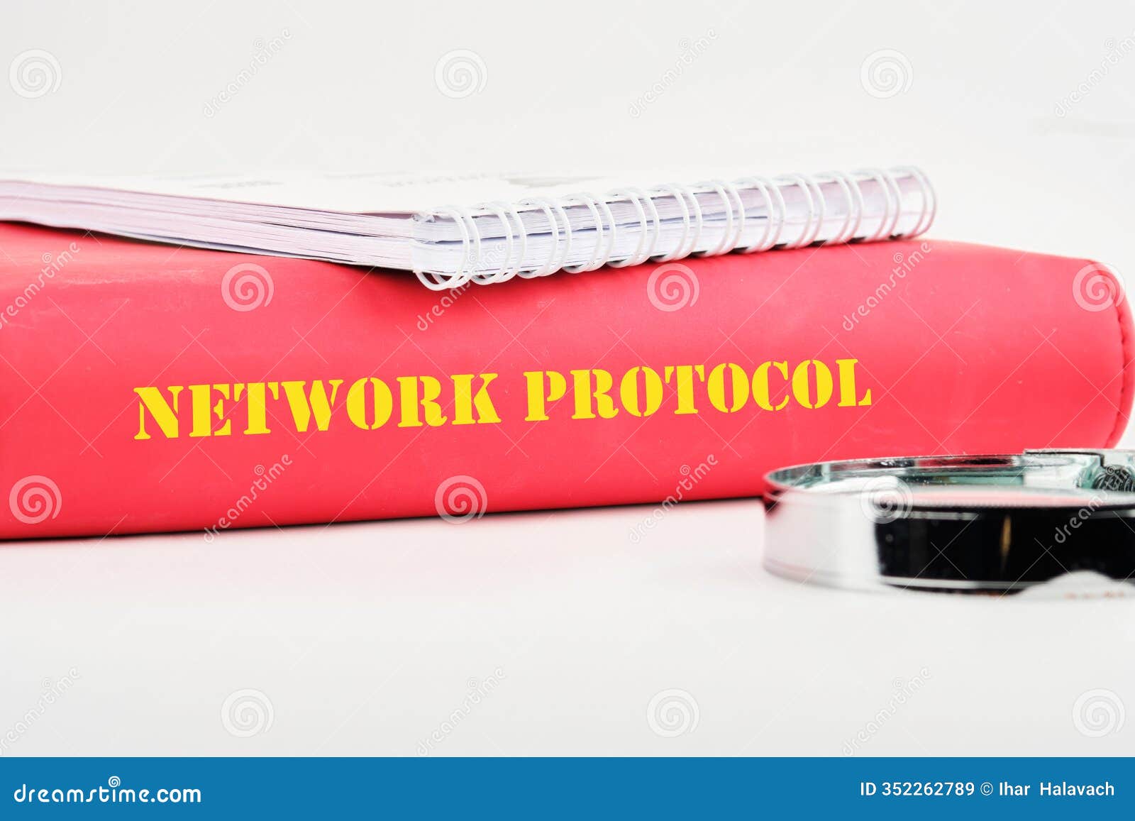 A Bright Red Binder Labeled Network Protocol Lies Open on a Clean ...