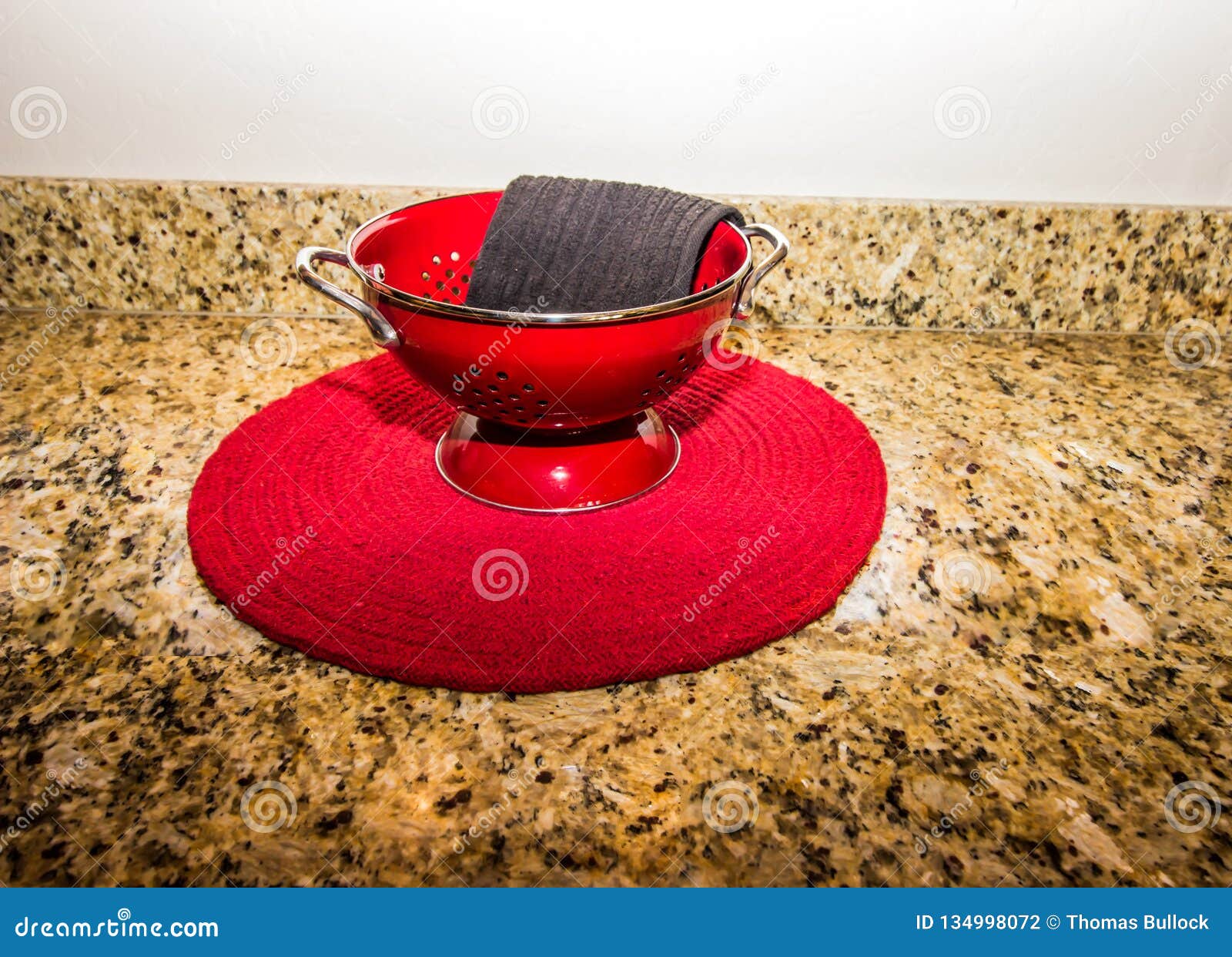 Bright Red Colander on Modern Granite Kitchen Counter Stock Photo ...