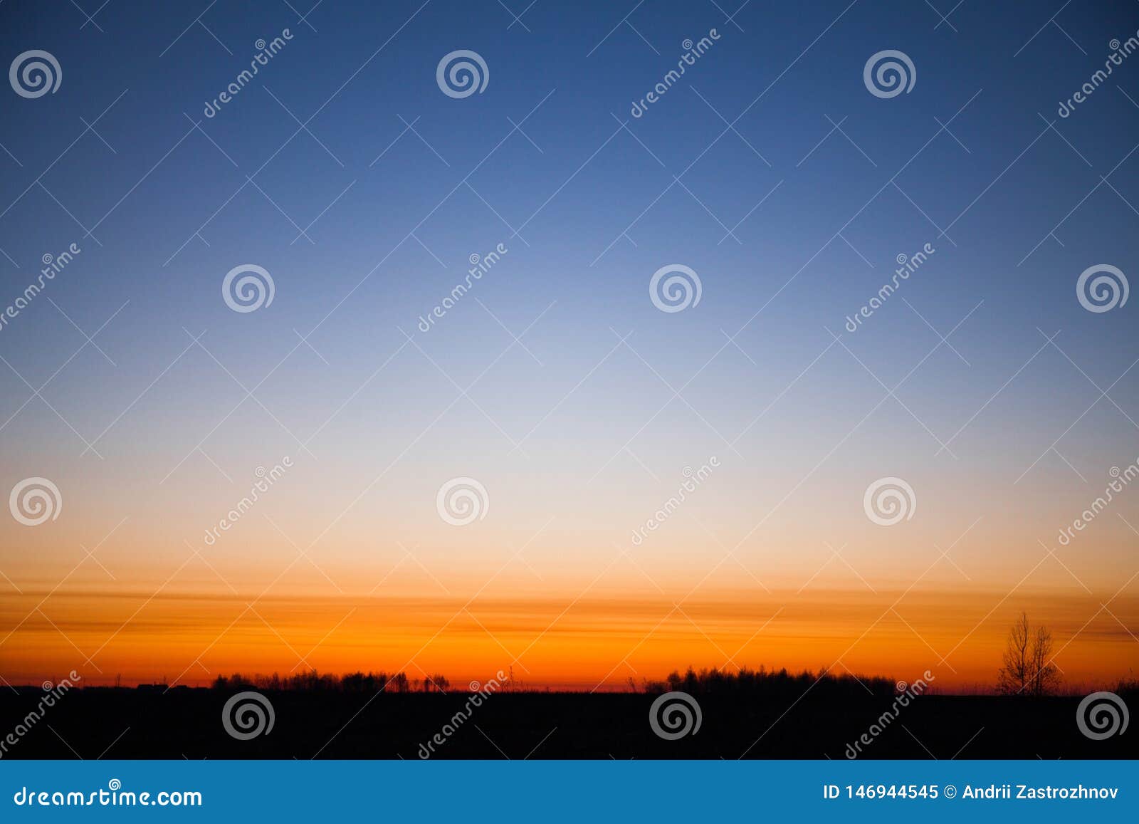 Bright Red Dawn with a Cloudless Blue Sky. Silhouette of the Earth and ...