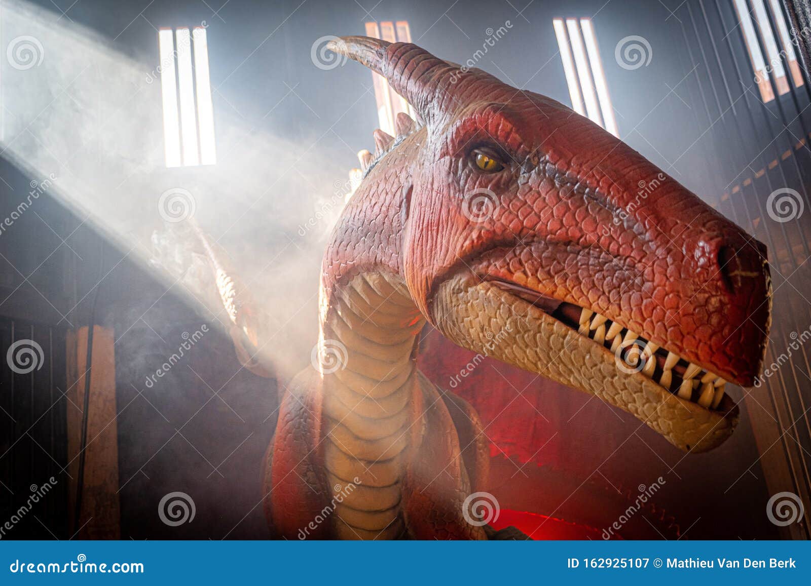 Bright Red Dragon in a Dungeon in England with Rays of Light through ...