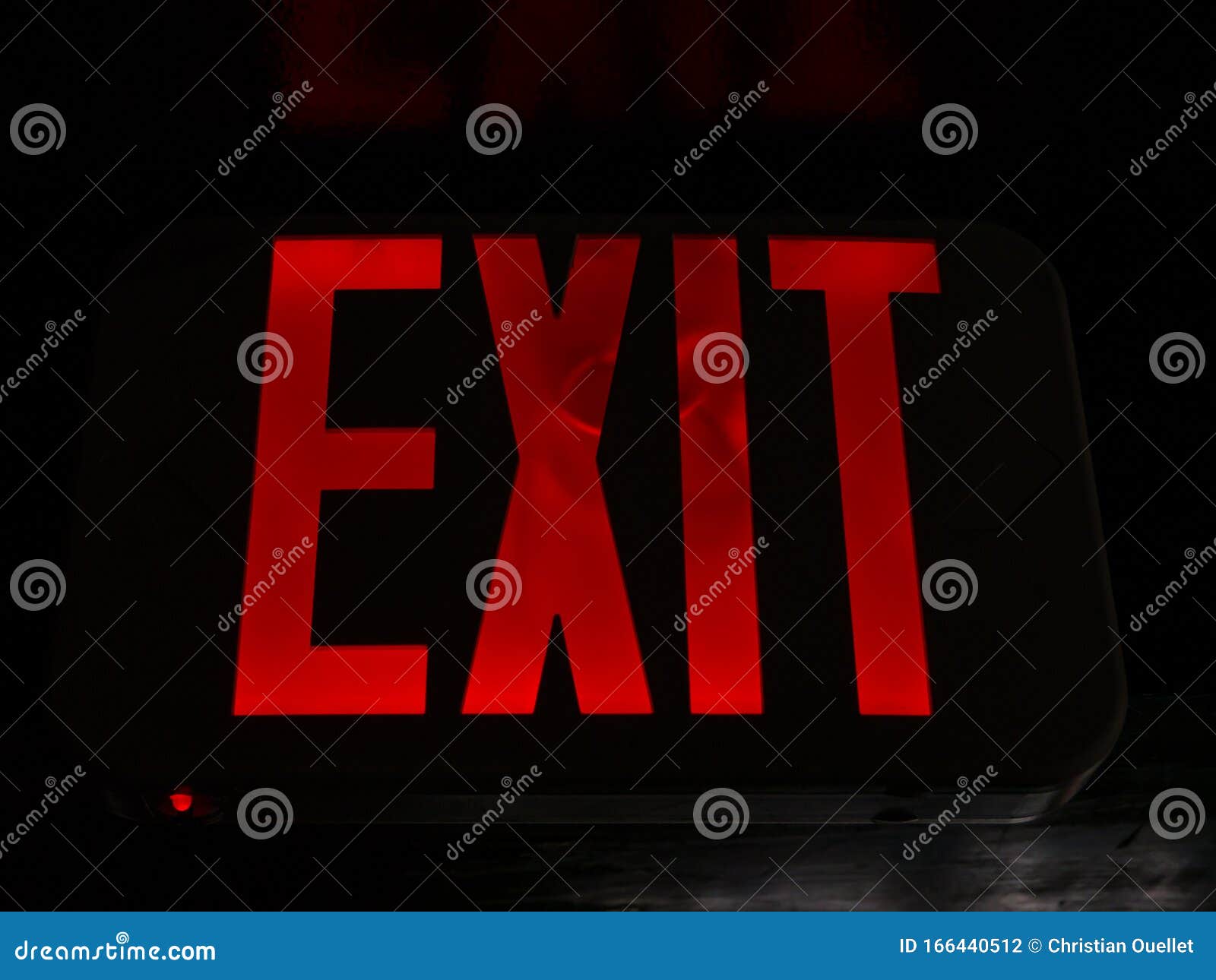 A bright red `EXIT` sign stock photo. Image of letter - 166440512