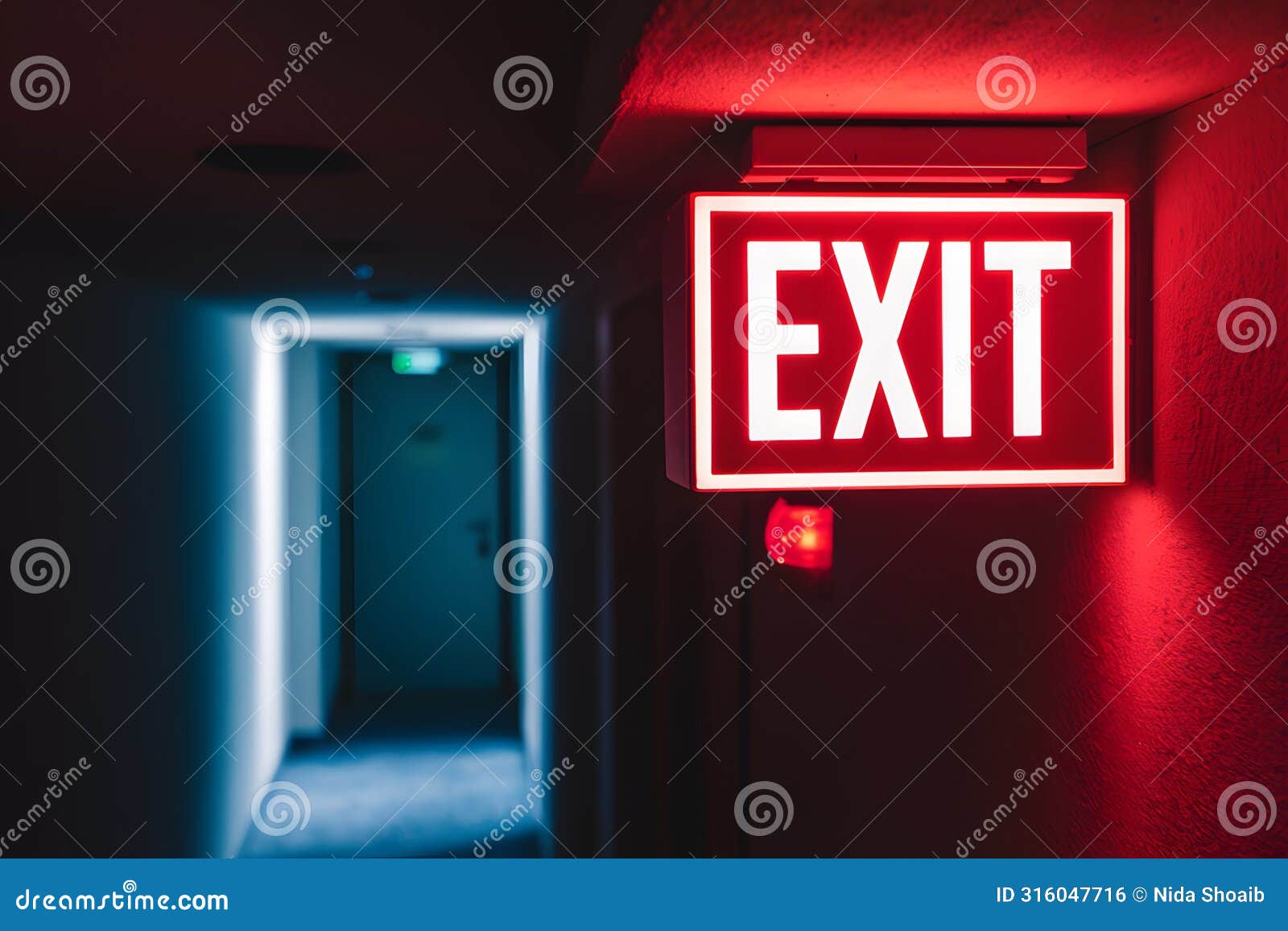 Bright Red EXIT Sign in Dim Corridor with Door, Suggesting Preparedness ...