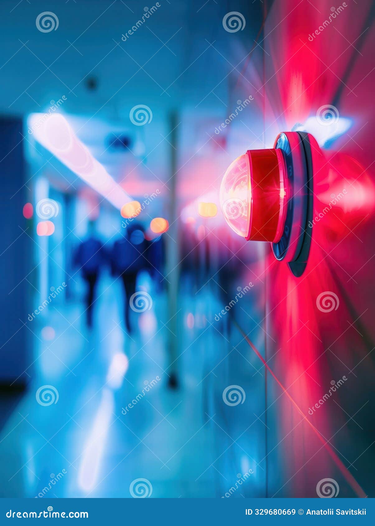 A Bright Red Fire Alarm Light and Button are Mounted on the Wall in a ...