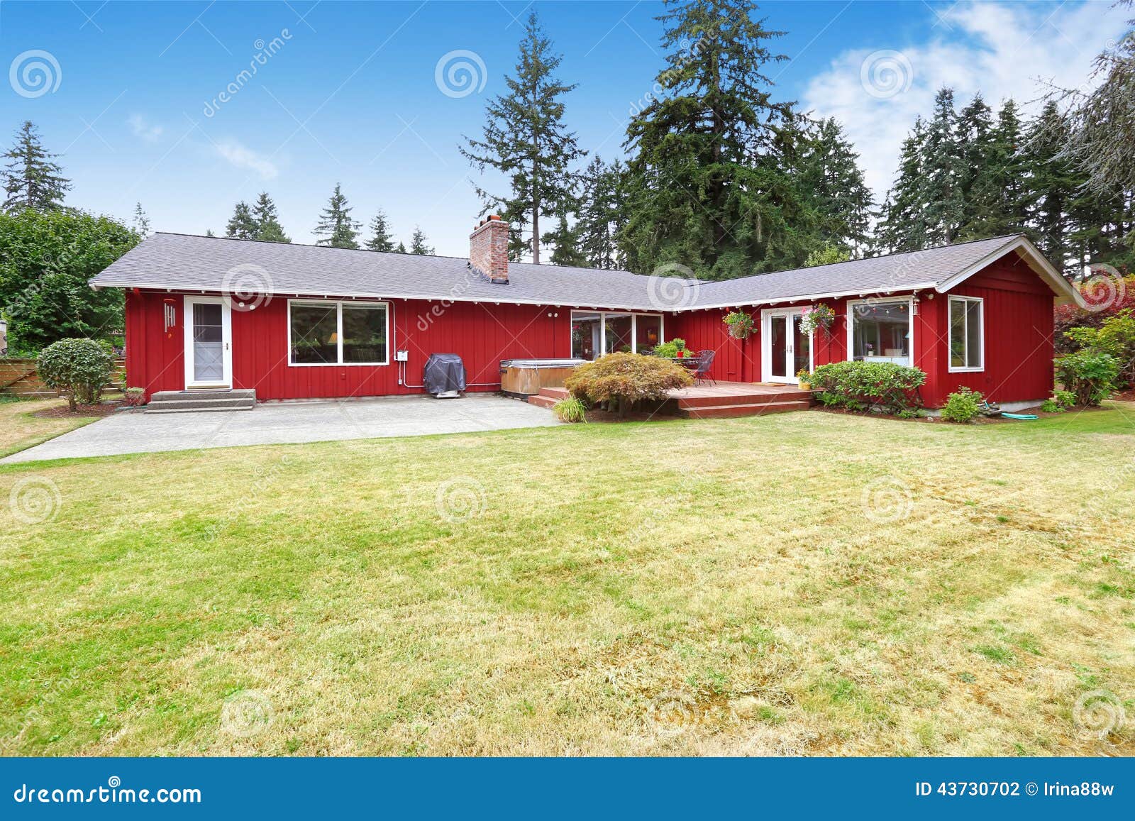 Bright Red House with Walkout Deck and Patio Area Stock Photo - Image ...
