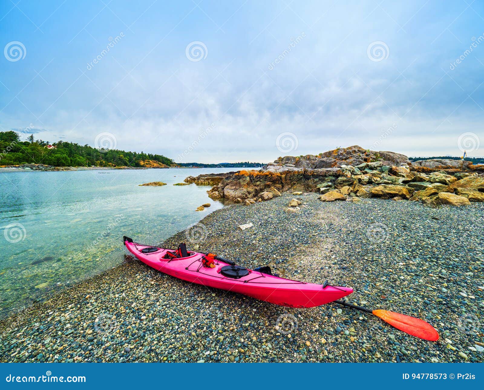 Bright Red Kayak on a Pebble Ocean Beach Stock Image - Image of ...