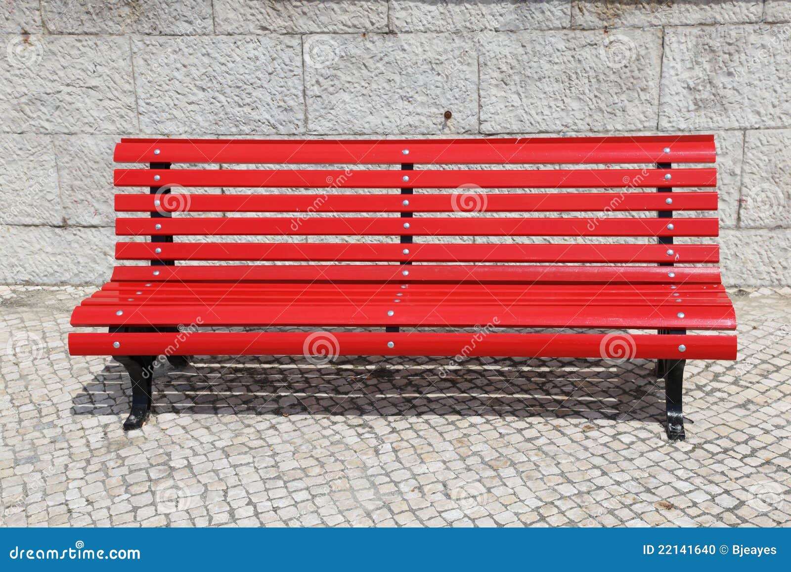Bright red park bench stock photo. Image of outdoor, cobblestone - 22141640