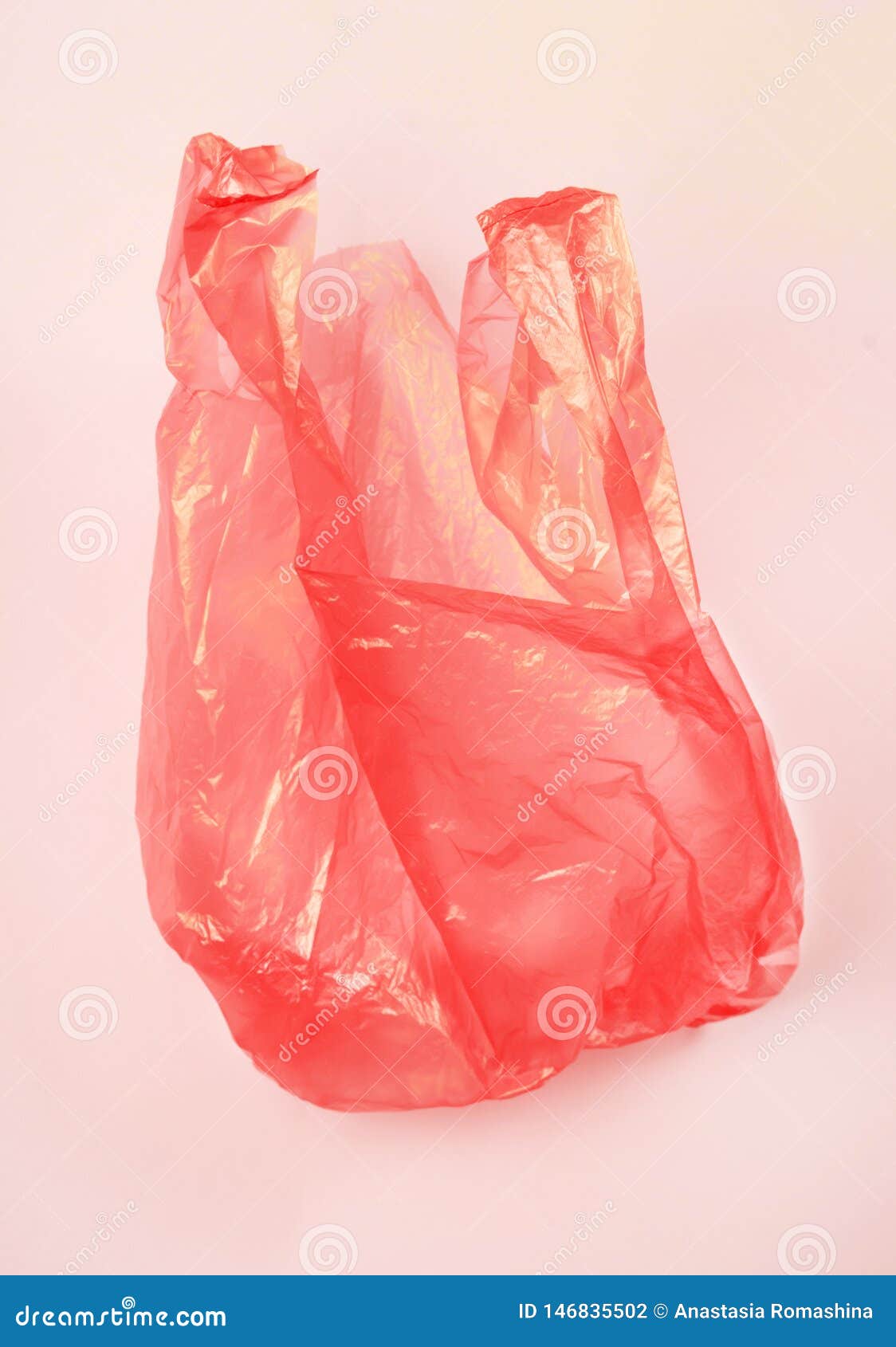 Bright Red Plastic Bag on Light Red Background. Stock Photo - Image of ...