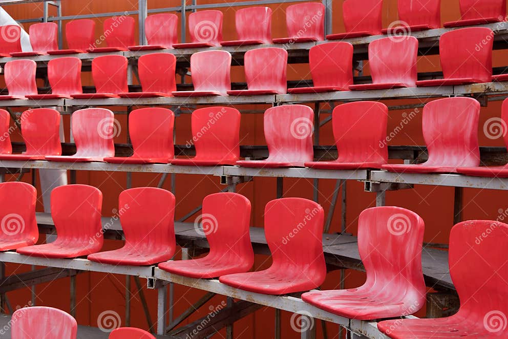 Bright red stadium seats stock image. Image of multiple - 89665537