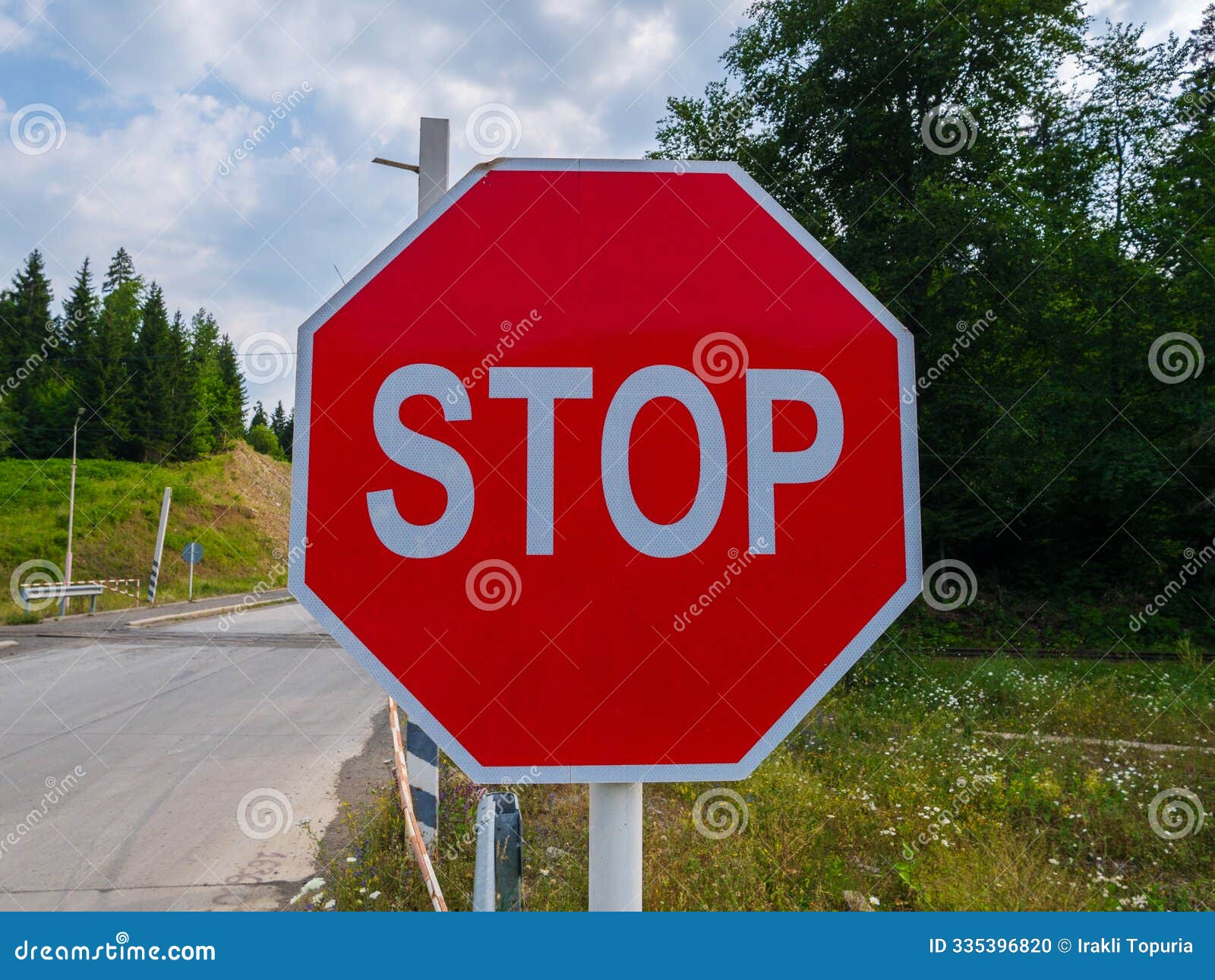 Bright Red Octagonal Stop Sign on the Road Stock Photo - Image of ...