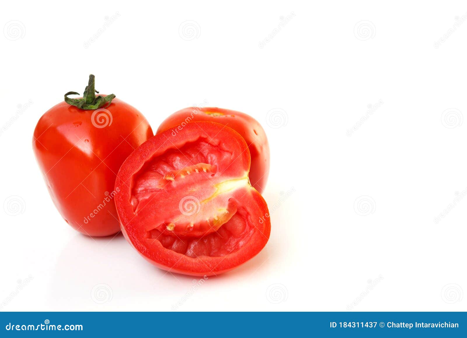Bright Red Tomatoes, Cut in Half, on a White Background. Focus on the ...