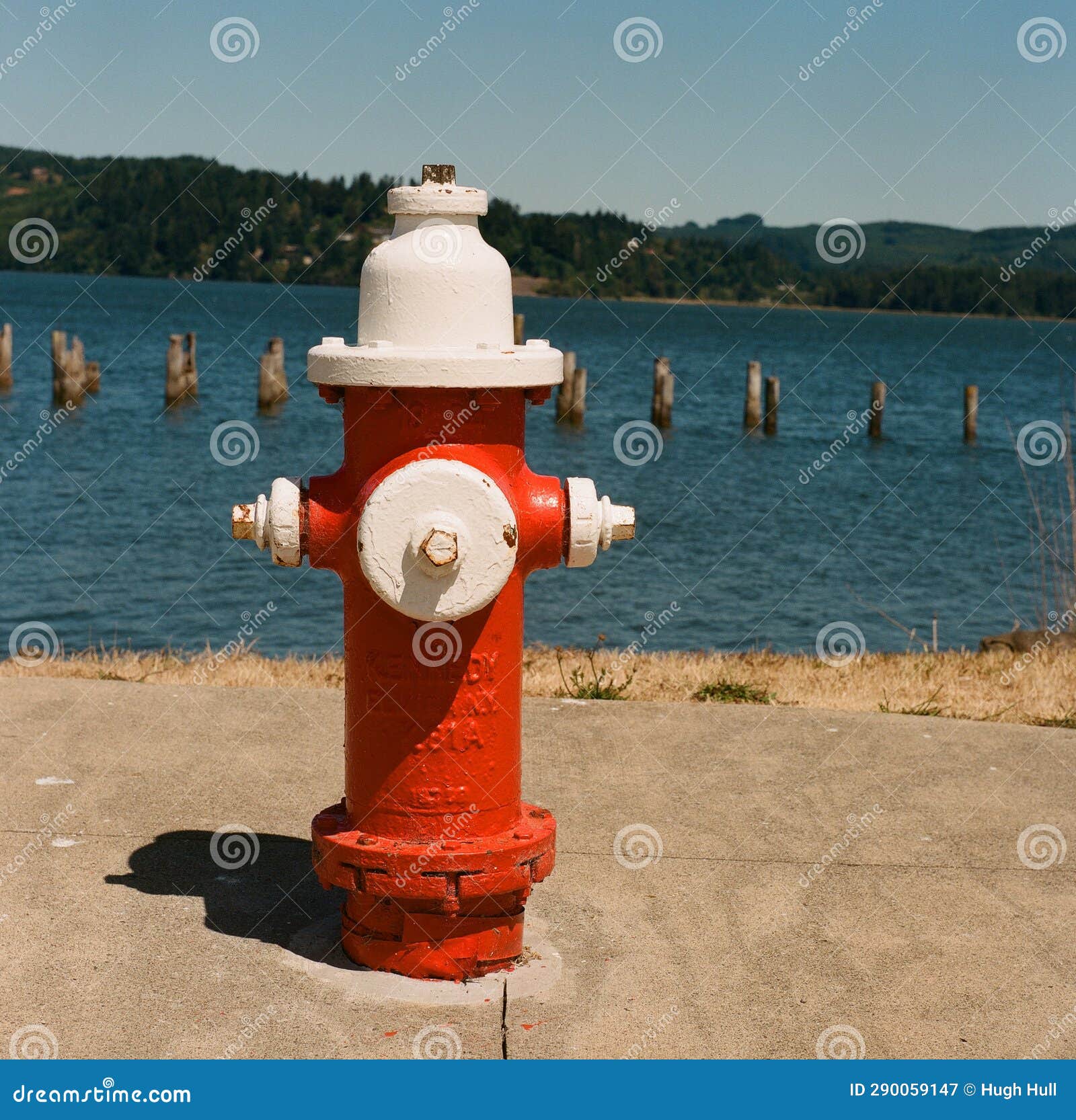 Bright Red and White Fire Hydrant Along the Bay Stock Image - Image of ...