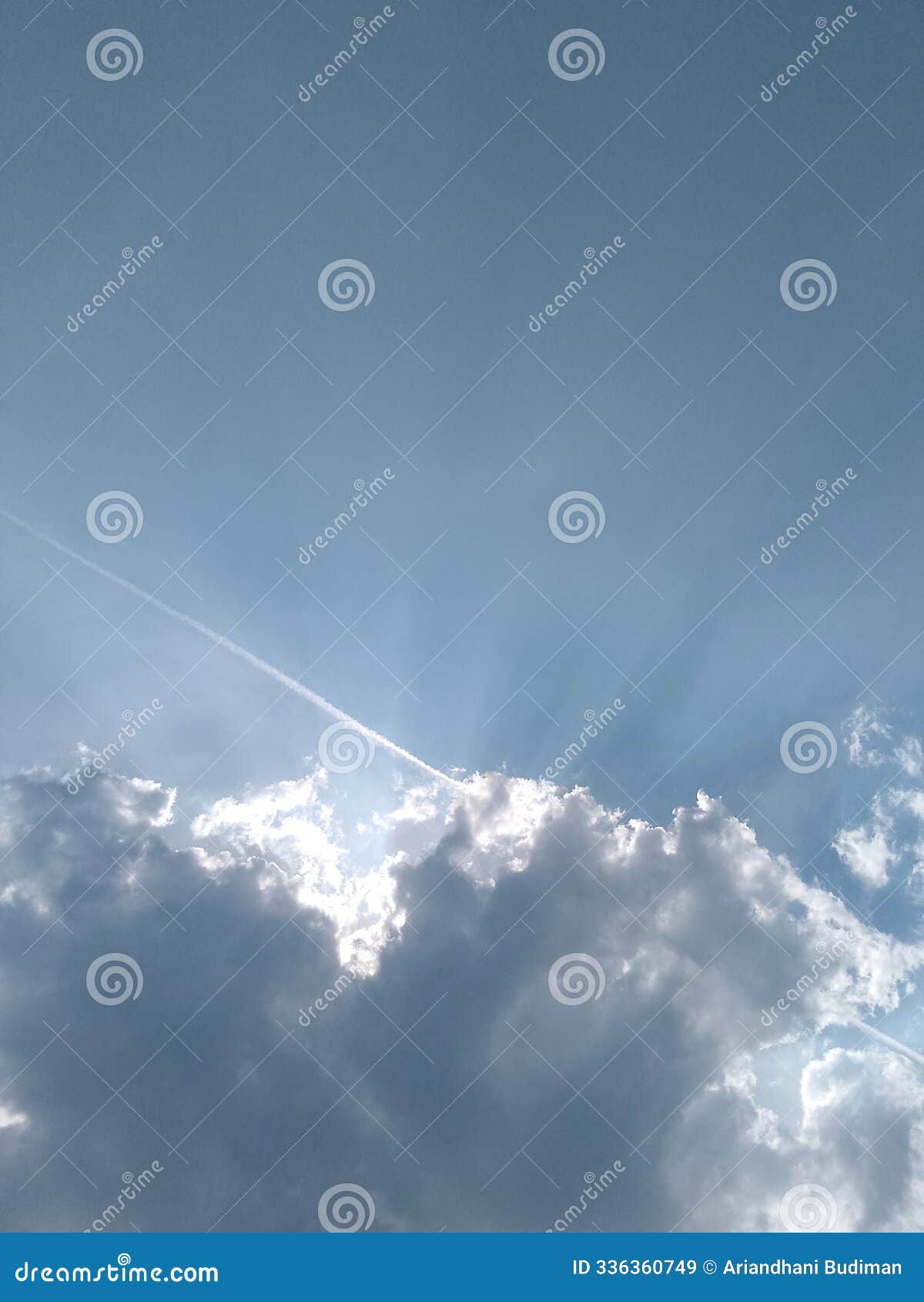 A Bright, Serene Sky Features Soft, Billowing Clouds Partially ...