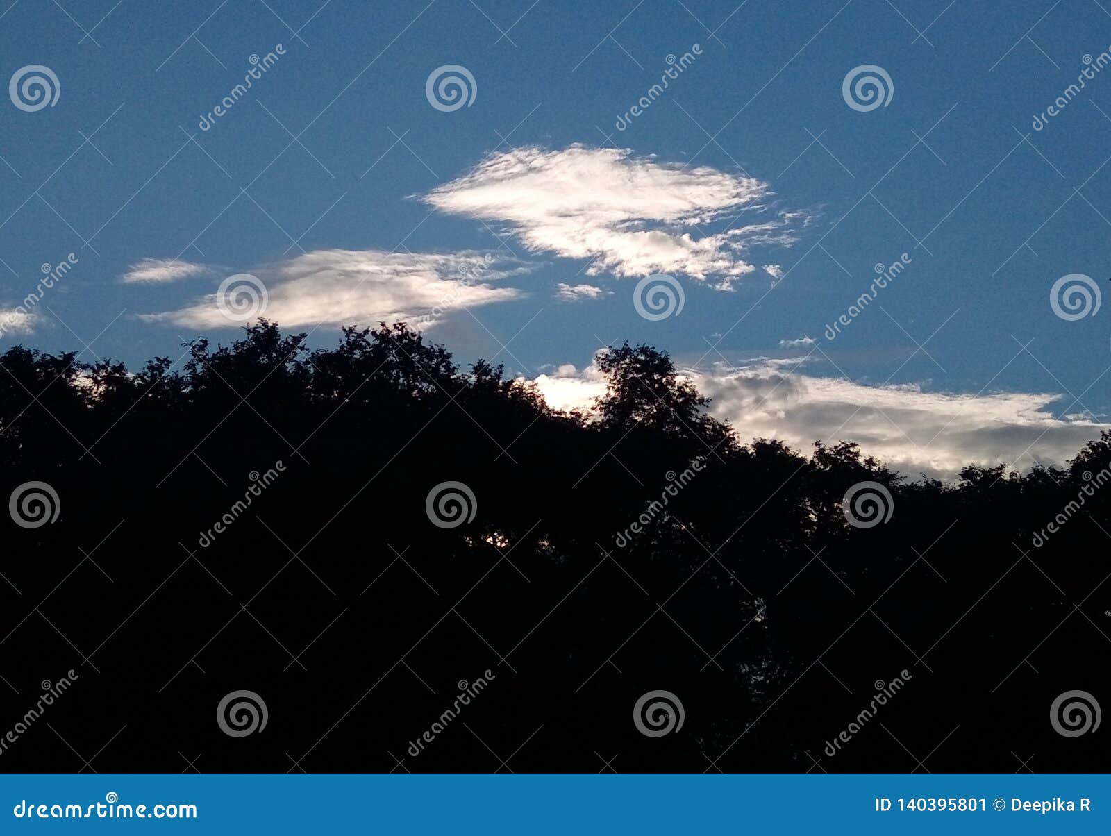 A Bright Silver Glow on Clouds in a Blue Sky Stock Image - Image of ...