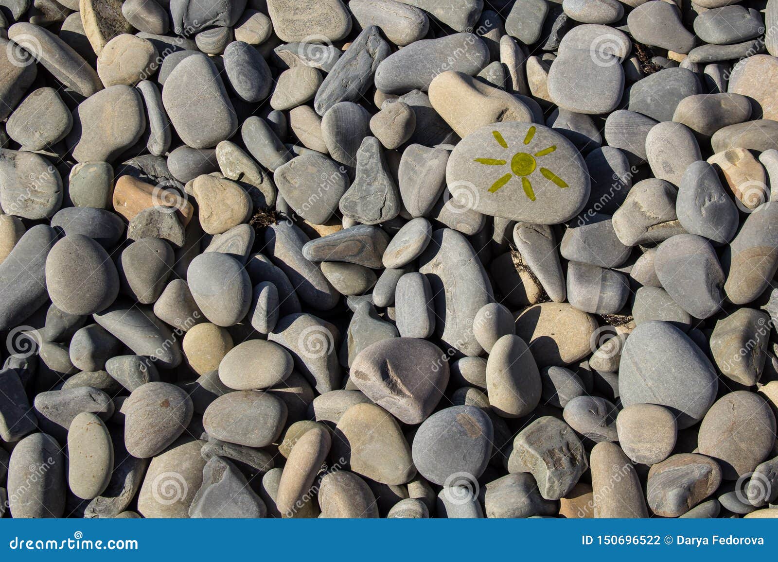 Bright Sun Painted on Pebble. Pebbles Background Stock Photo - Image of ...