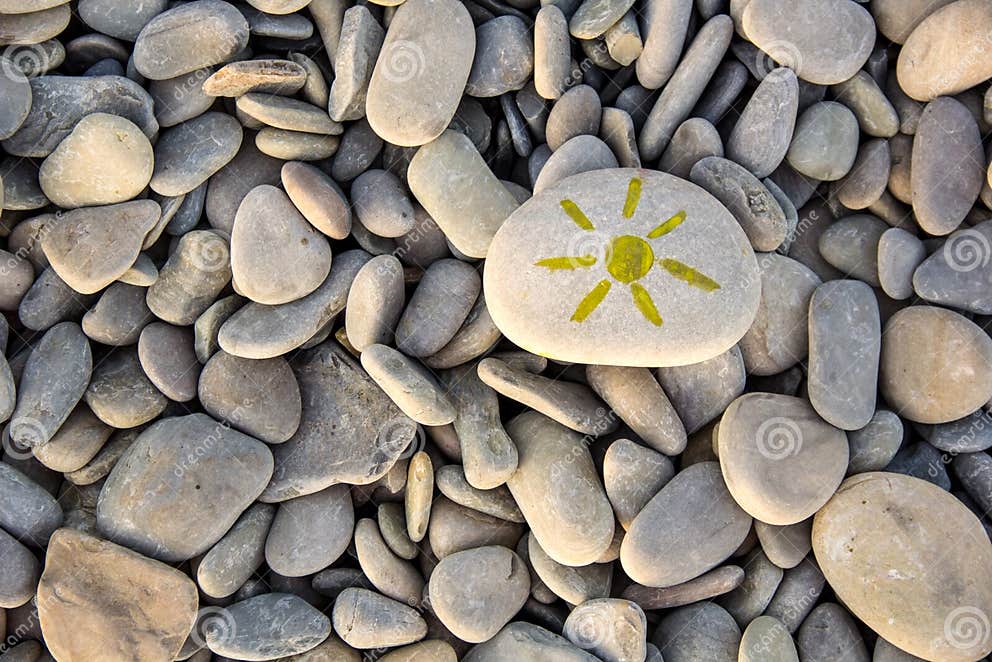 Bright Sun Painted on Pebble. Pebbles Background Stock Image - Image of ...