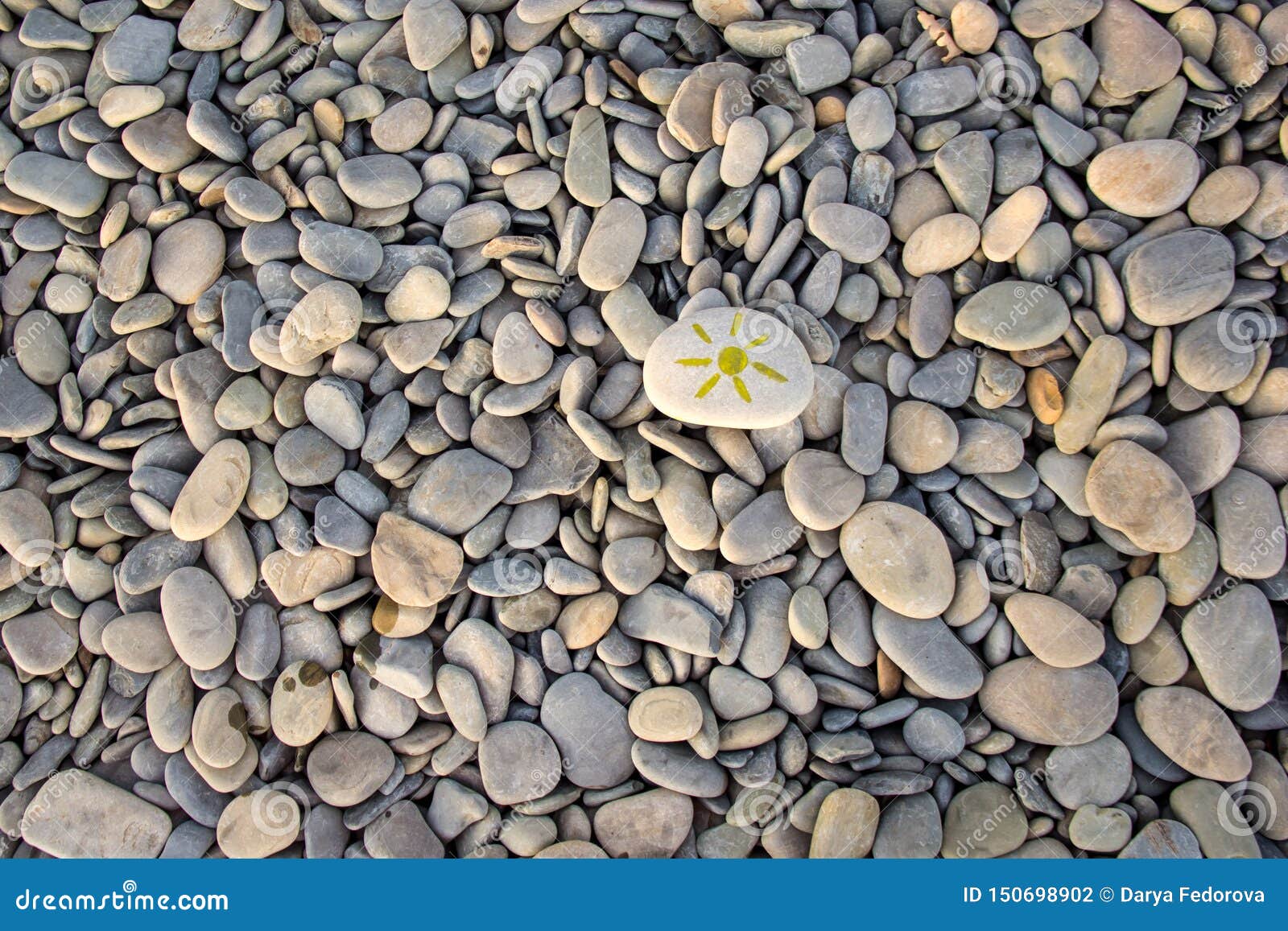 Bright Sun Painted on Pebble. Pebbles Background Stock Photo - Image of ...