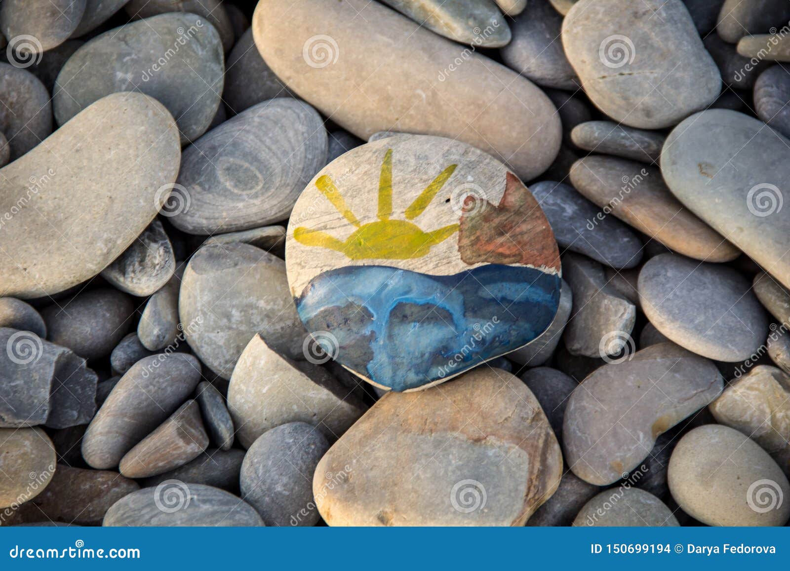 Bright Sun Painted on Pebble. Pebbles and Sea Background Stock Photo ...