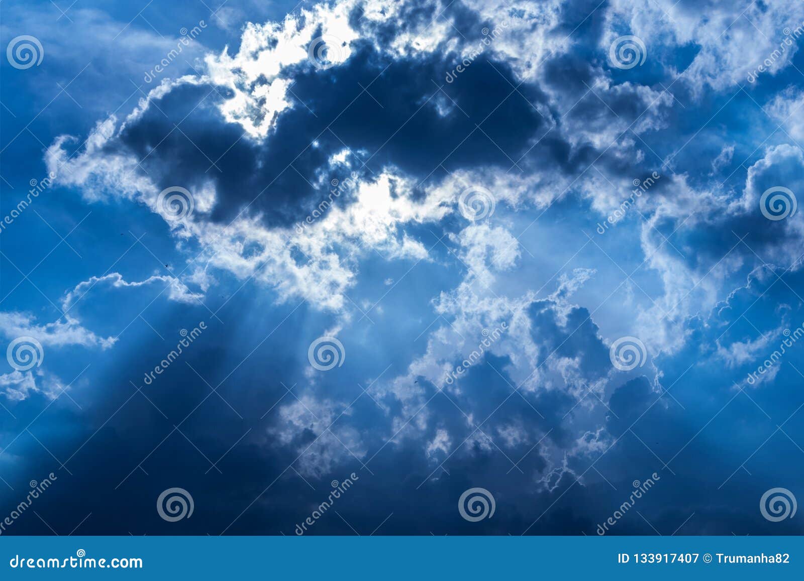 Sun Rays through Dark Blue Clouds Stock Image - Image of darkness, dark ...