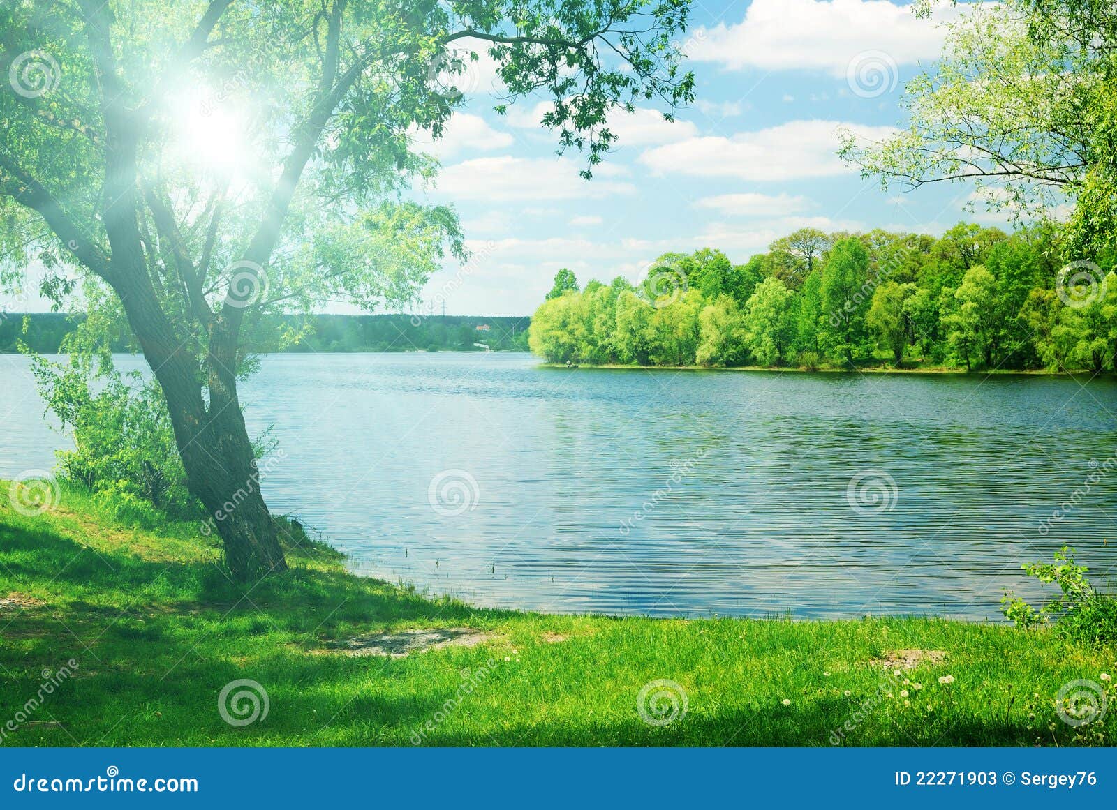 Bright Sunlight At Golden Hour On Large Lake With Dramatic And Moody ...
