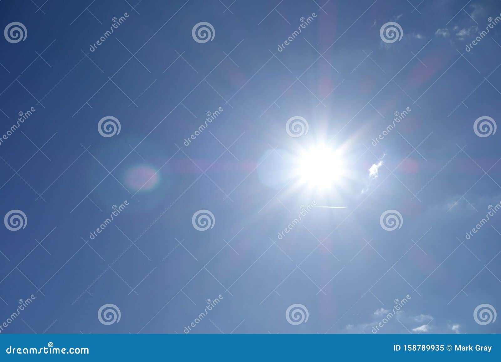 Bright Sunrays From Golden Sun Coming Through Clouds In Sunny Sky Over ...