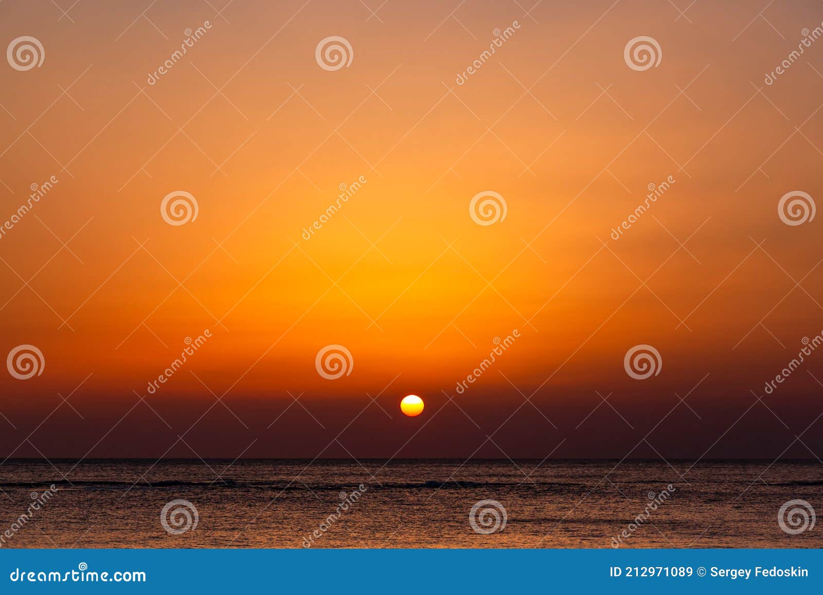 Bright Sunset with a Big Yellow Sun Under the Sea Surface Stock Image ...